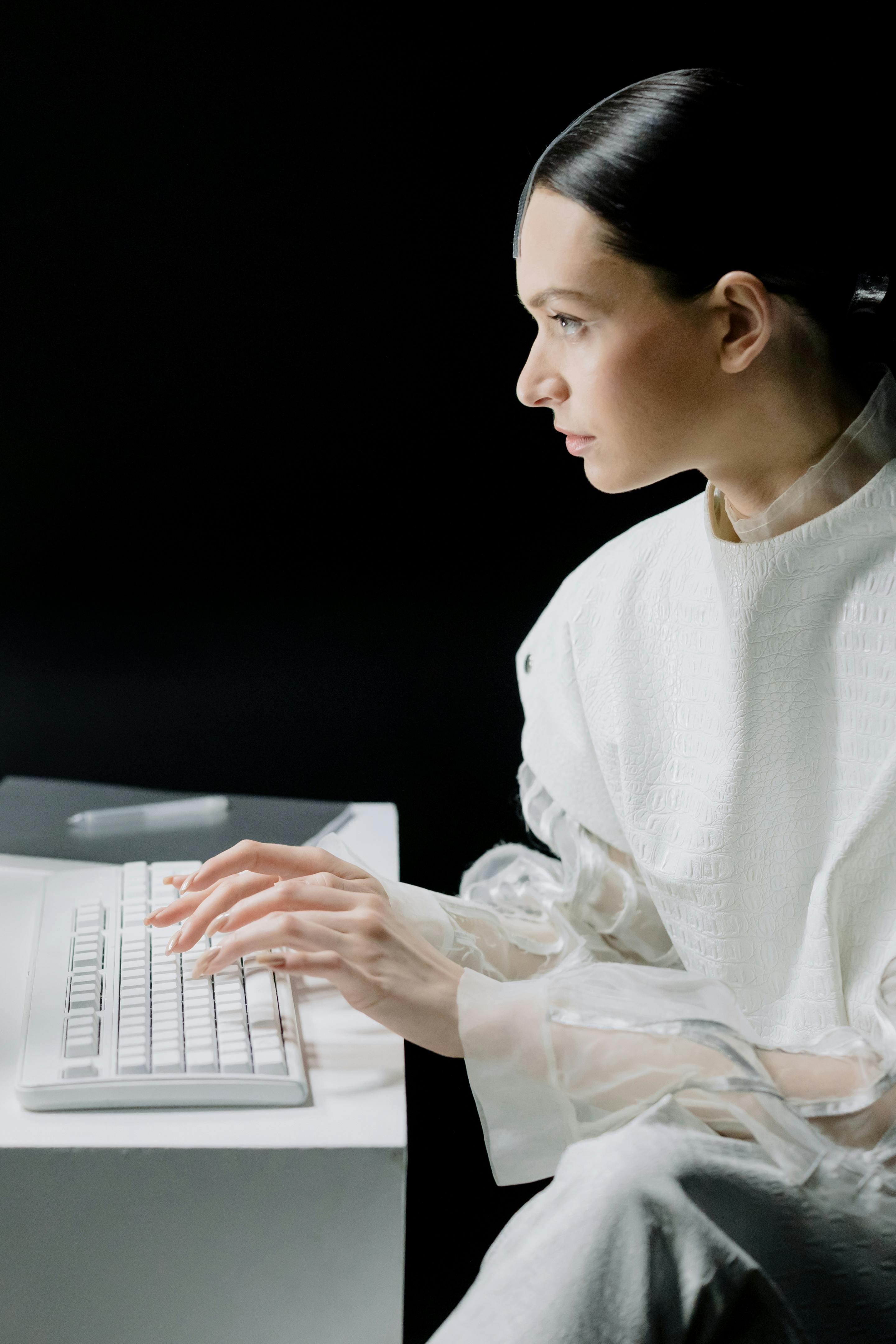 Woman Using a Computer for Work · Free Stock Photo