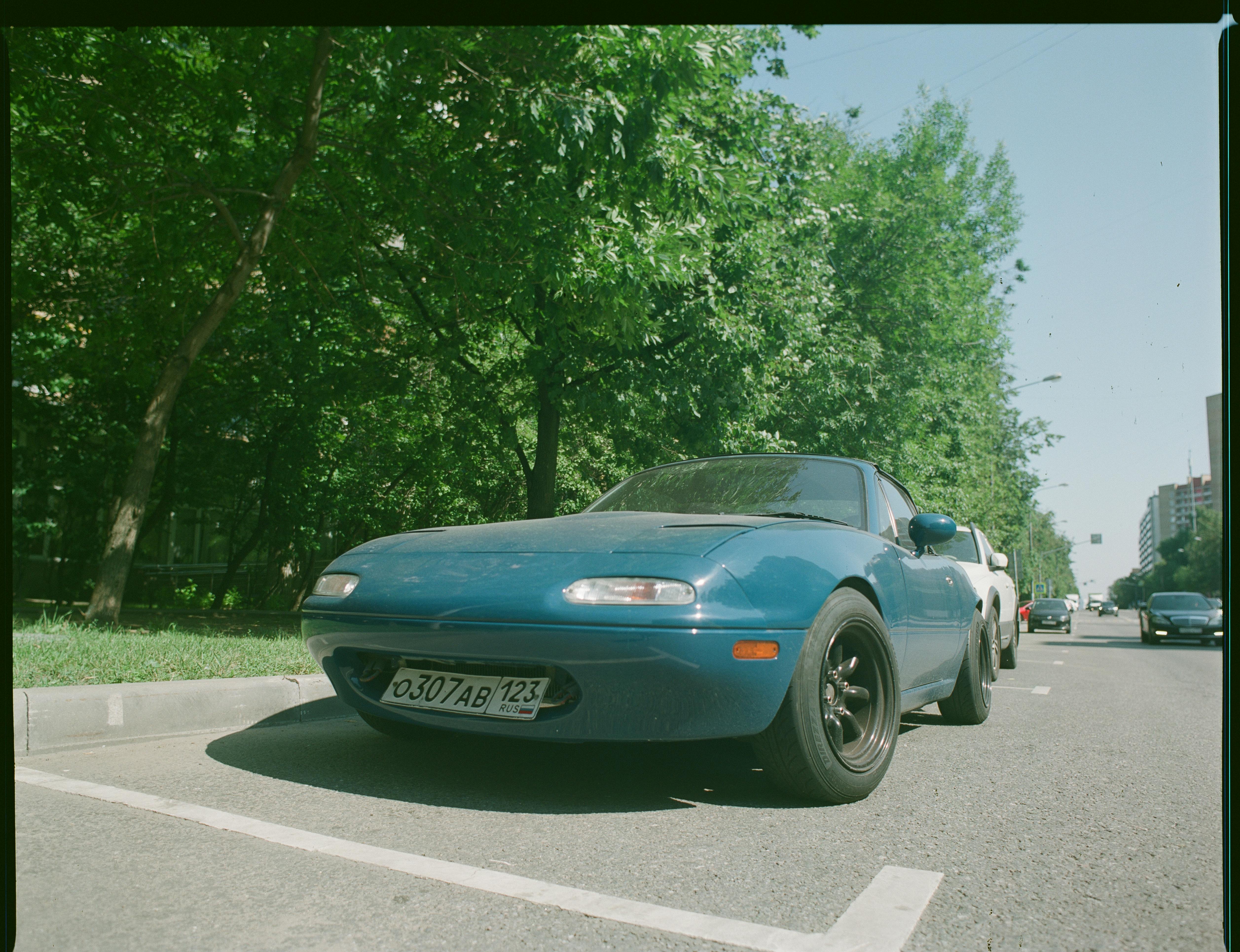 Low-Angle Shot of a Vintage Car Parked on the Side of the Road · Free ...