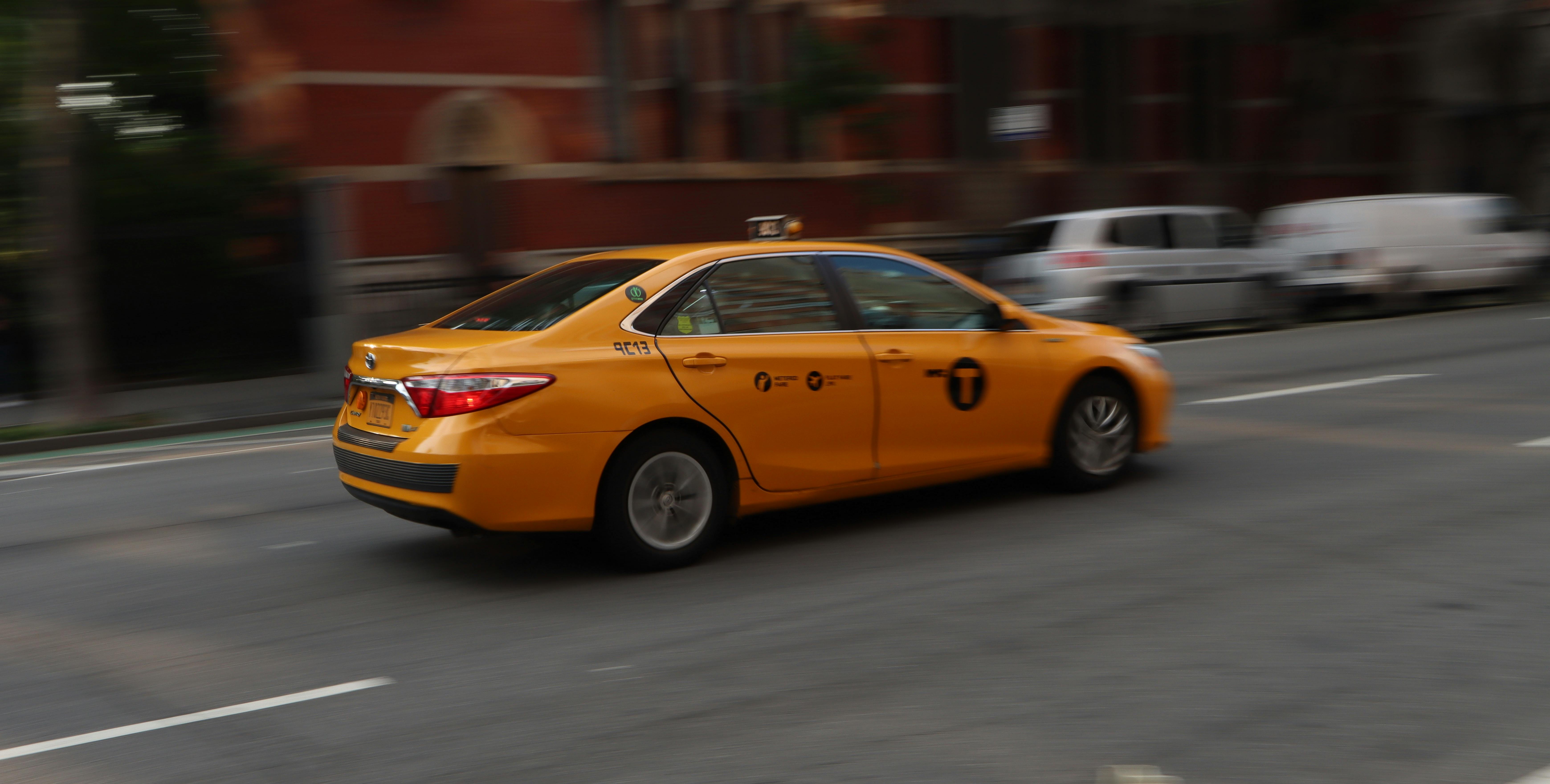Photo of a Fast Taxi on the Road · Free Stock Photo