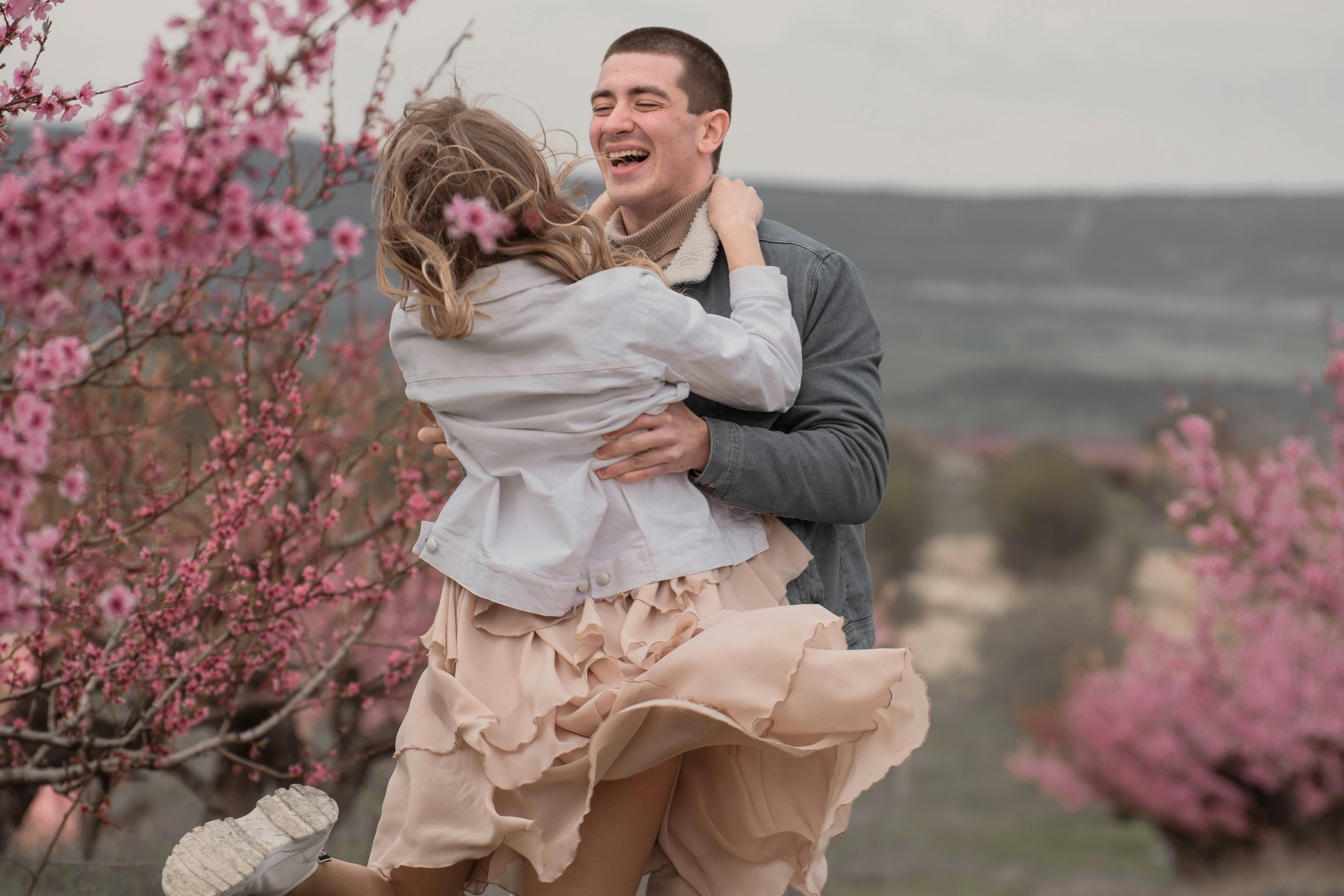 A Couple Hugging in the Flower Field · Free Stock Photo