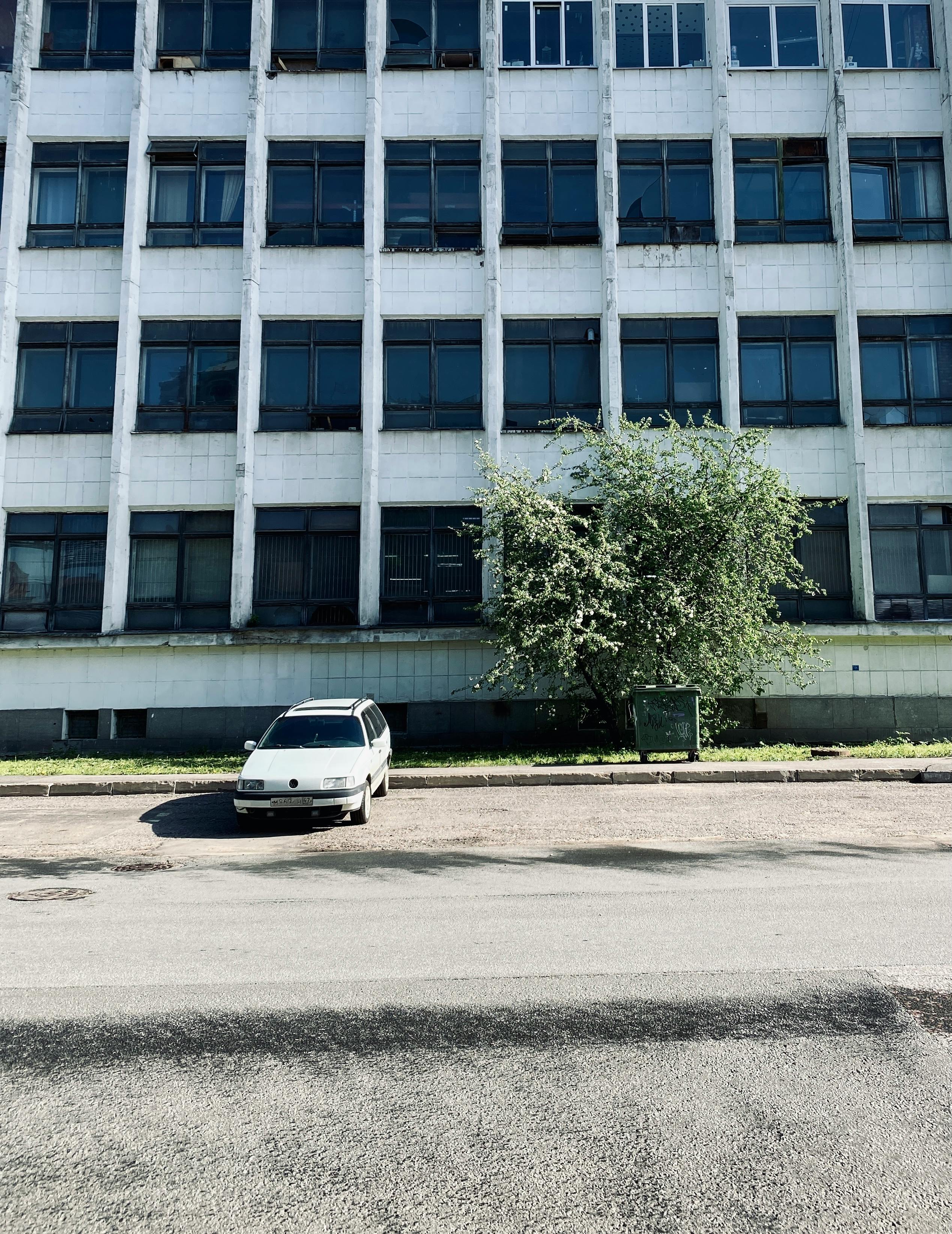 White Car Parked Near White Concrete Building · Free Stock Photo