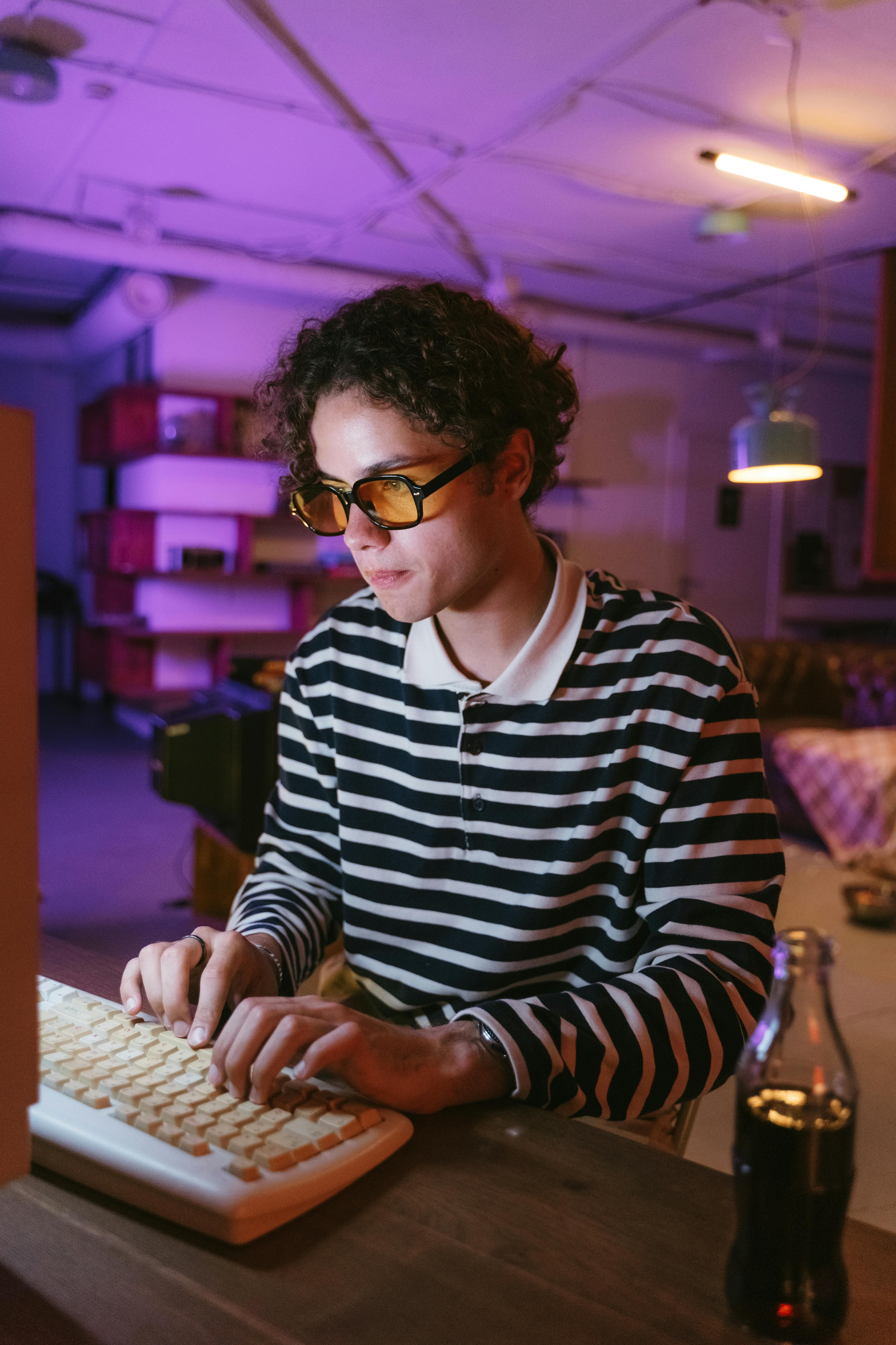 Teenage Boy Typing on Keyboard of Retro Computer · Free Stock Photo
