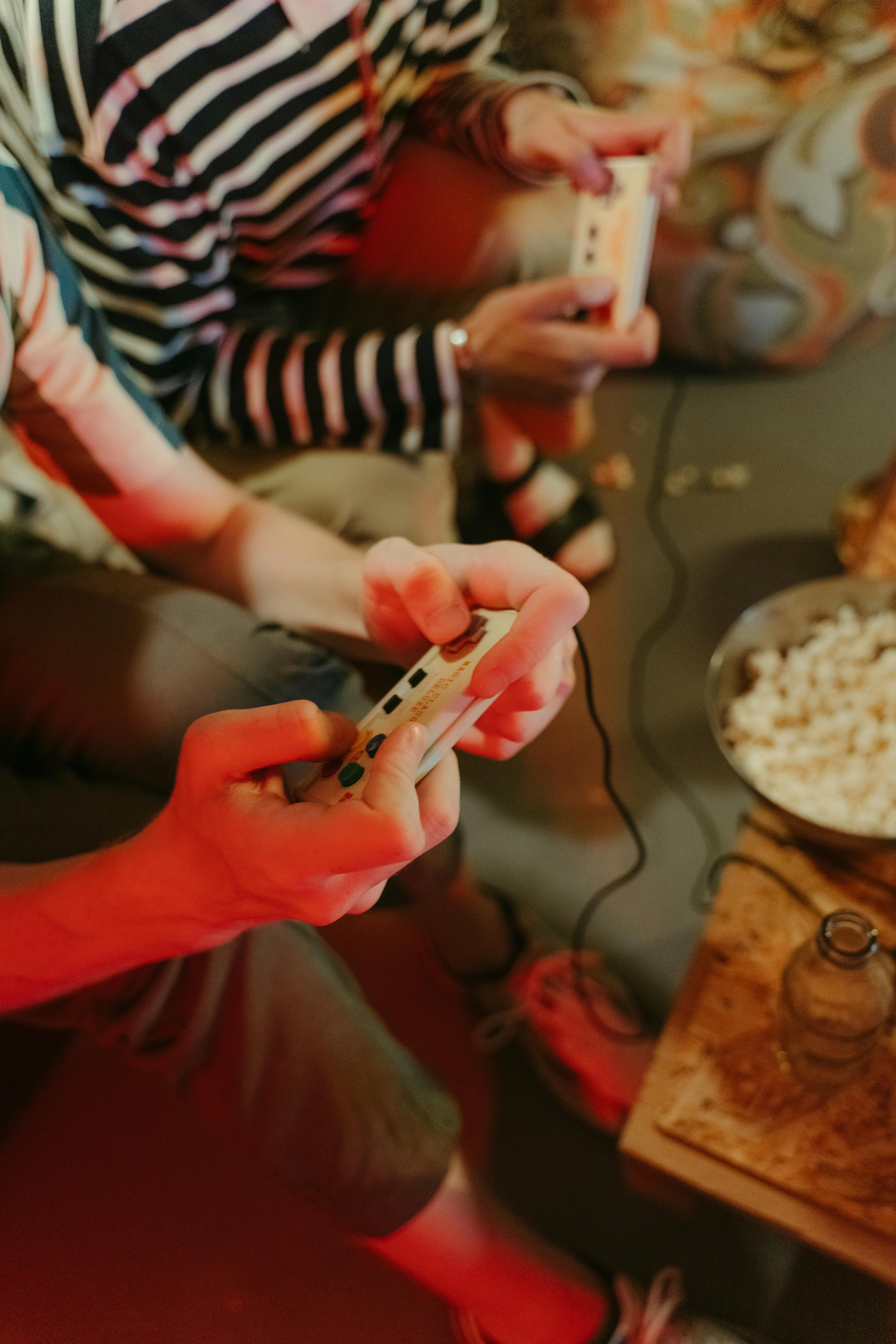 Person Holding White Video Game Controller · Free Stock Photo