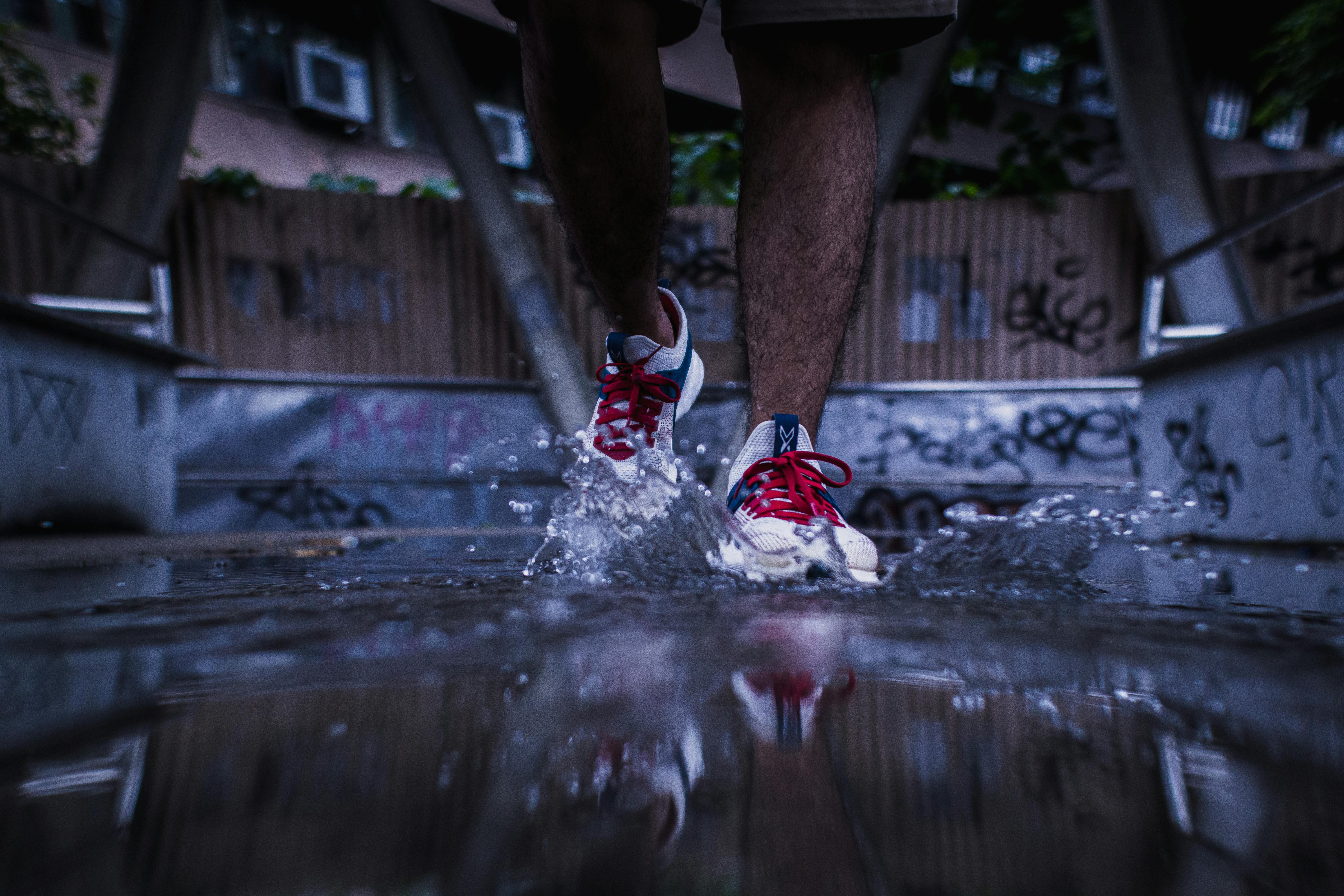 Person Walking on Wet Floor · Free Stock Photo