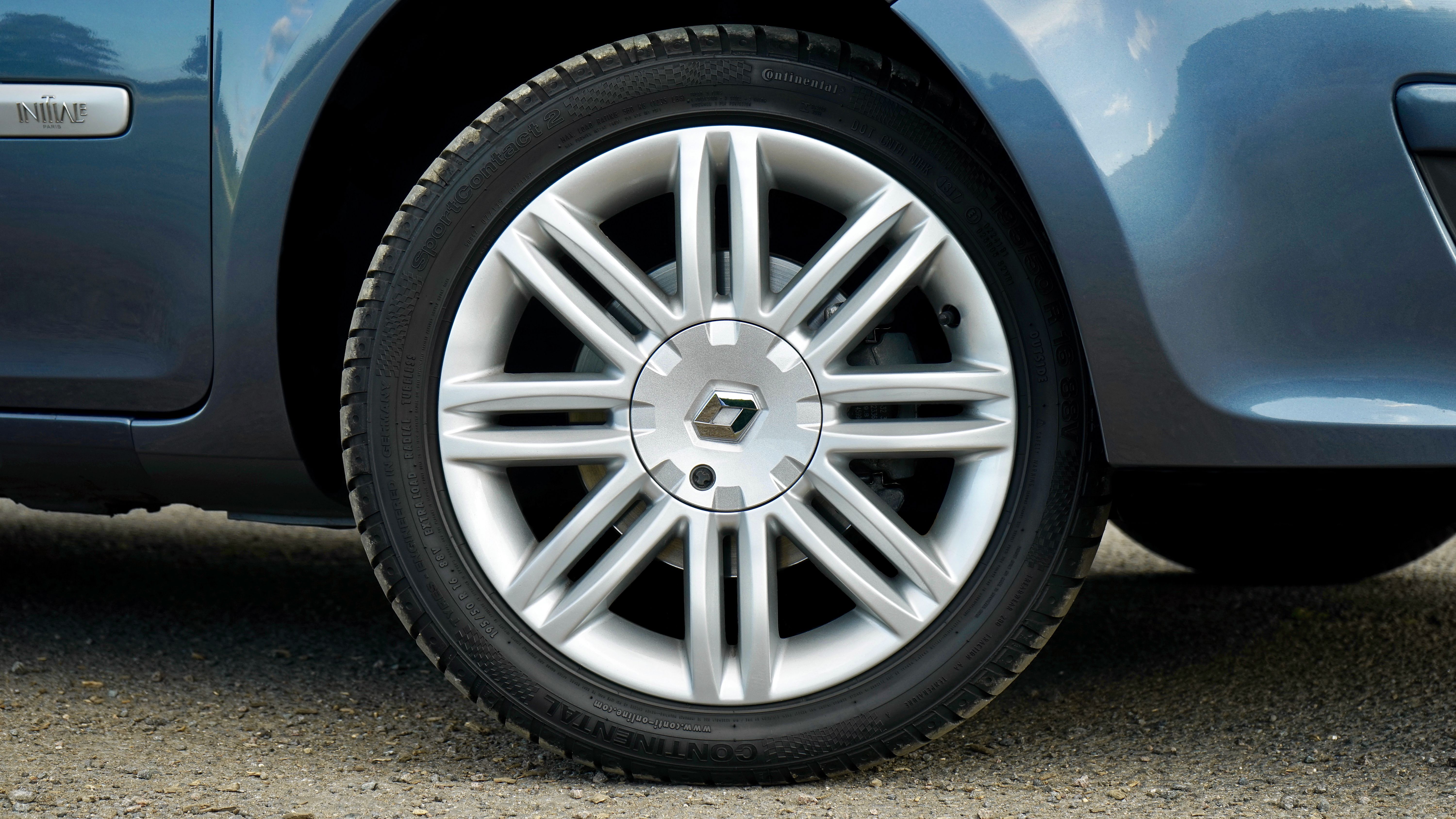 Photograph of a Blue Car's Wheel · Free Stock Photo