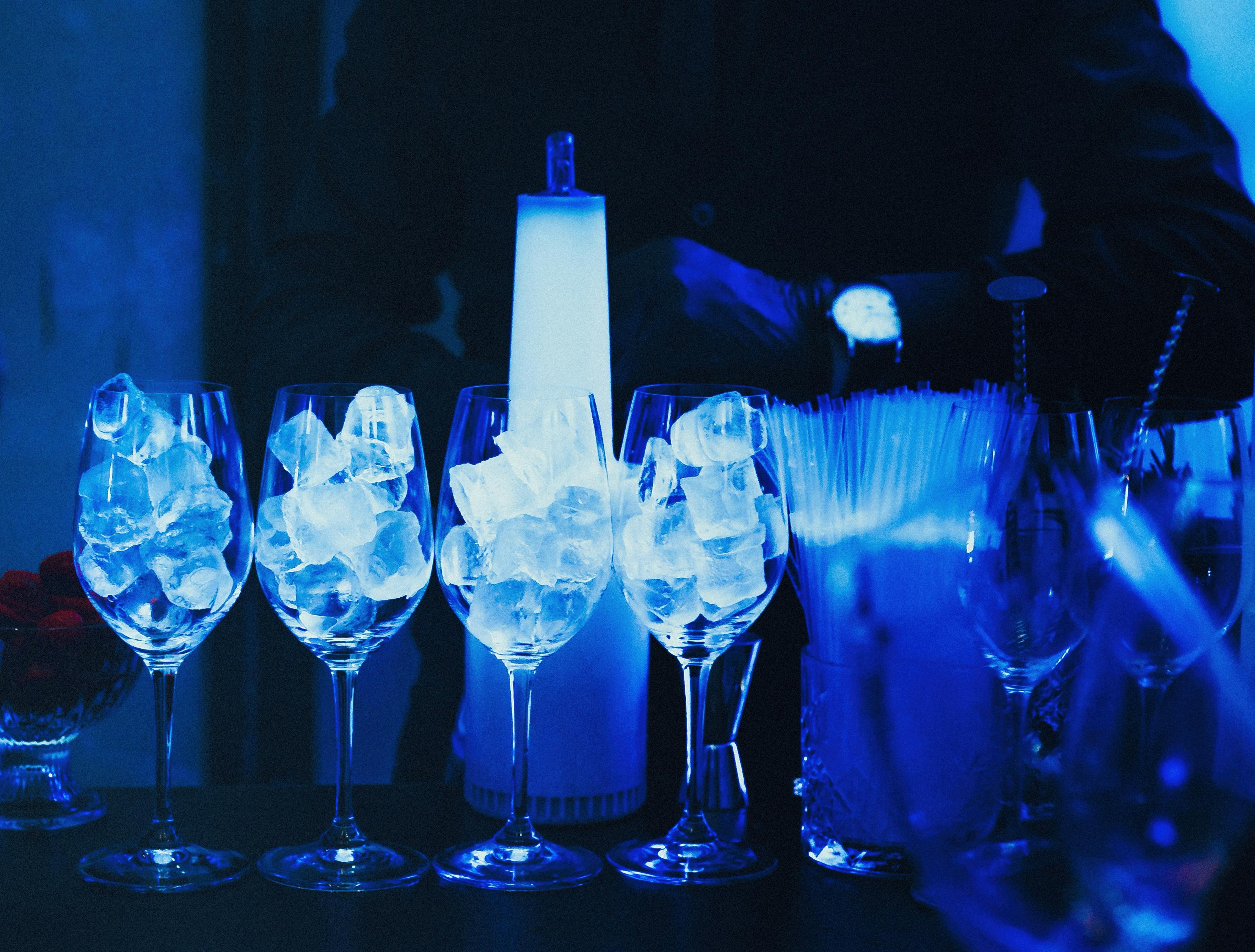 Man Drinking from Glass in Nightclub · Free Stock Photo