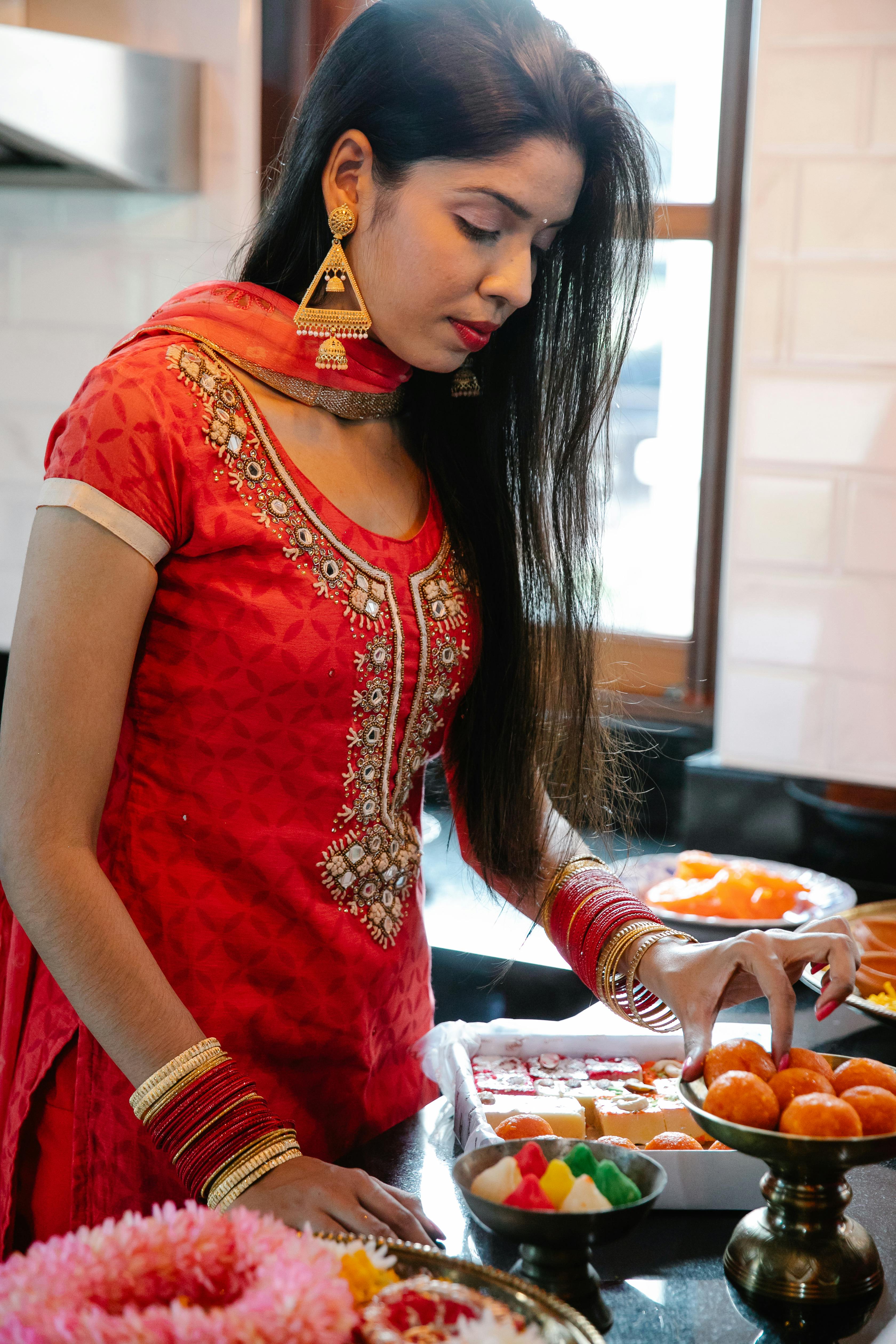 Woman Standing near Food on Table · Free Stock Photo