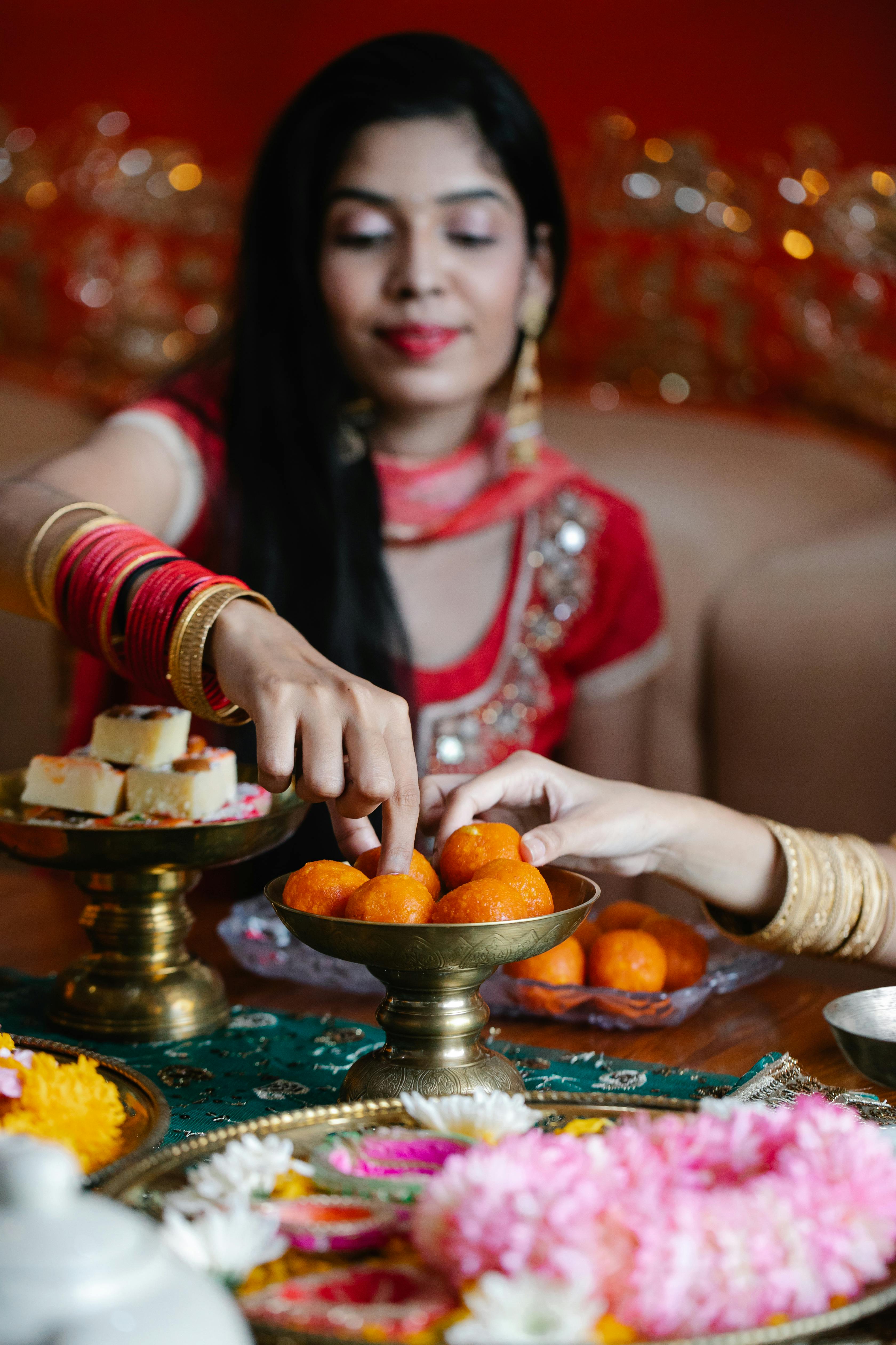 Woman in Traditional Clothing Sitting at a Table During a Feast · Free ...