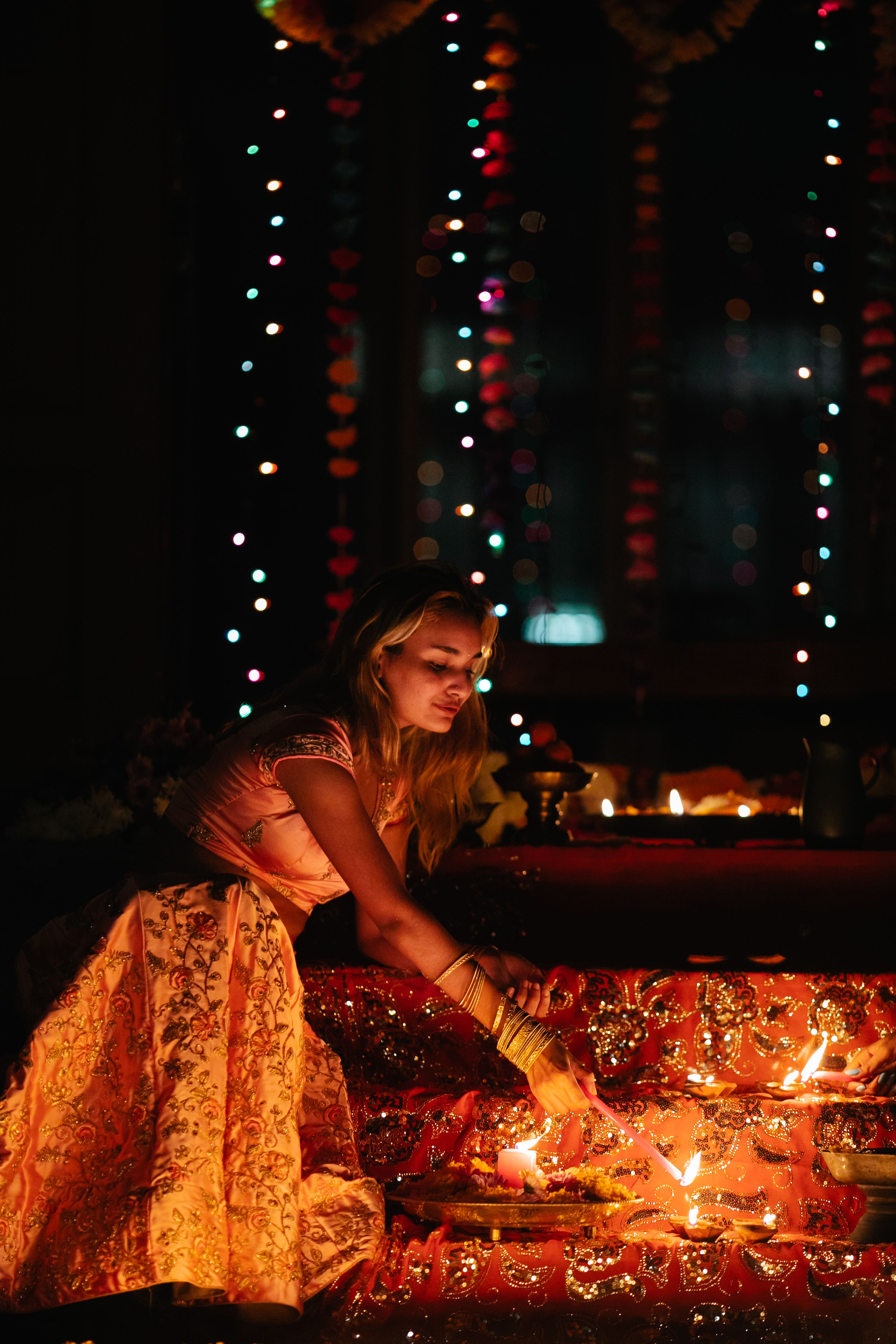 Woman Holding a Lighted Candle · Free Stock Photo