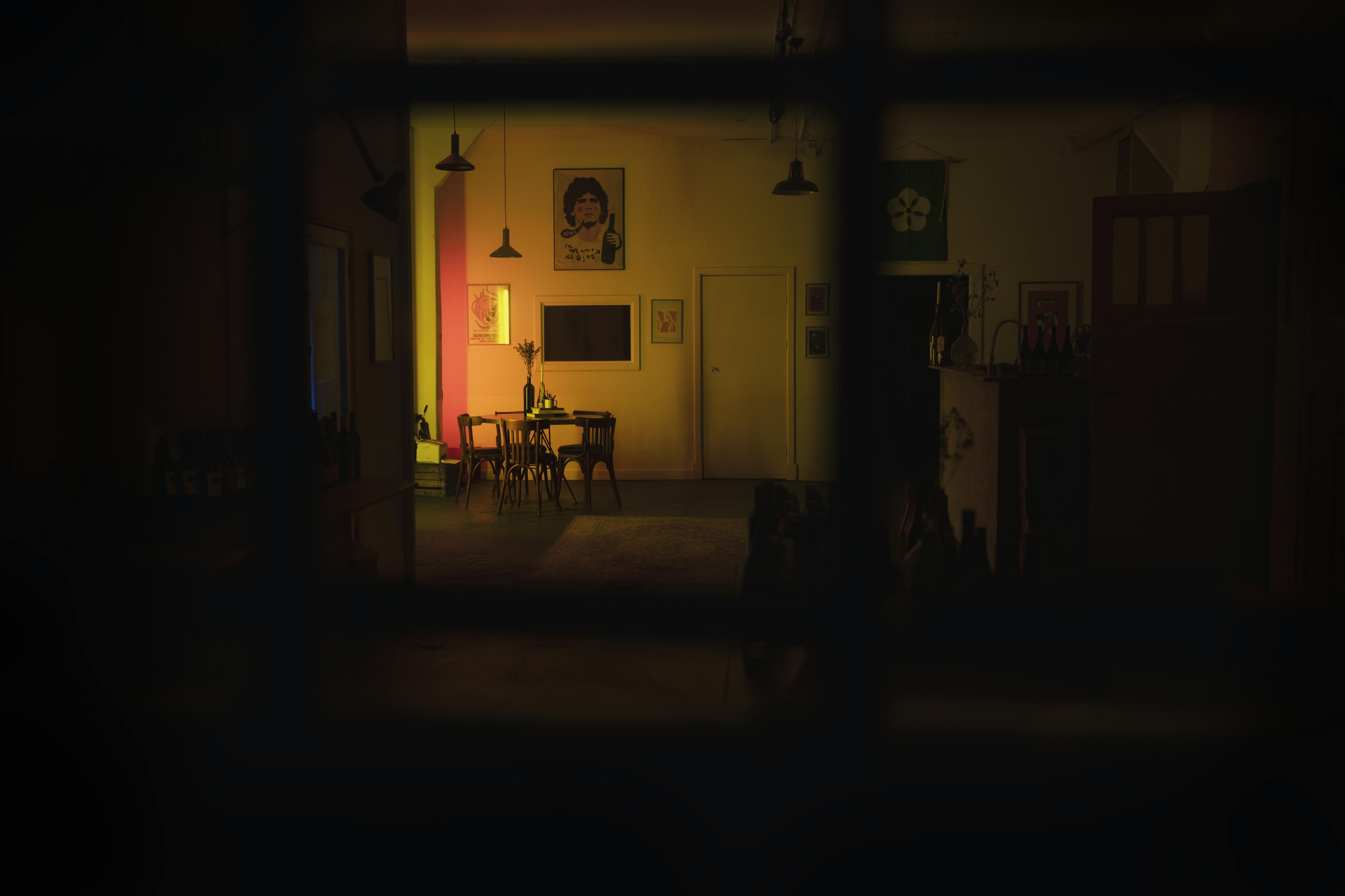 Table and Chairs Inside a Dark Room · Free Stock Photo