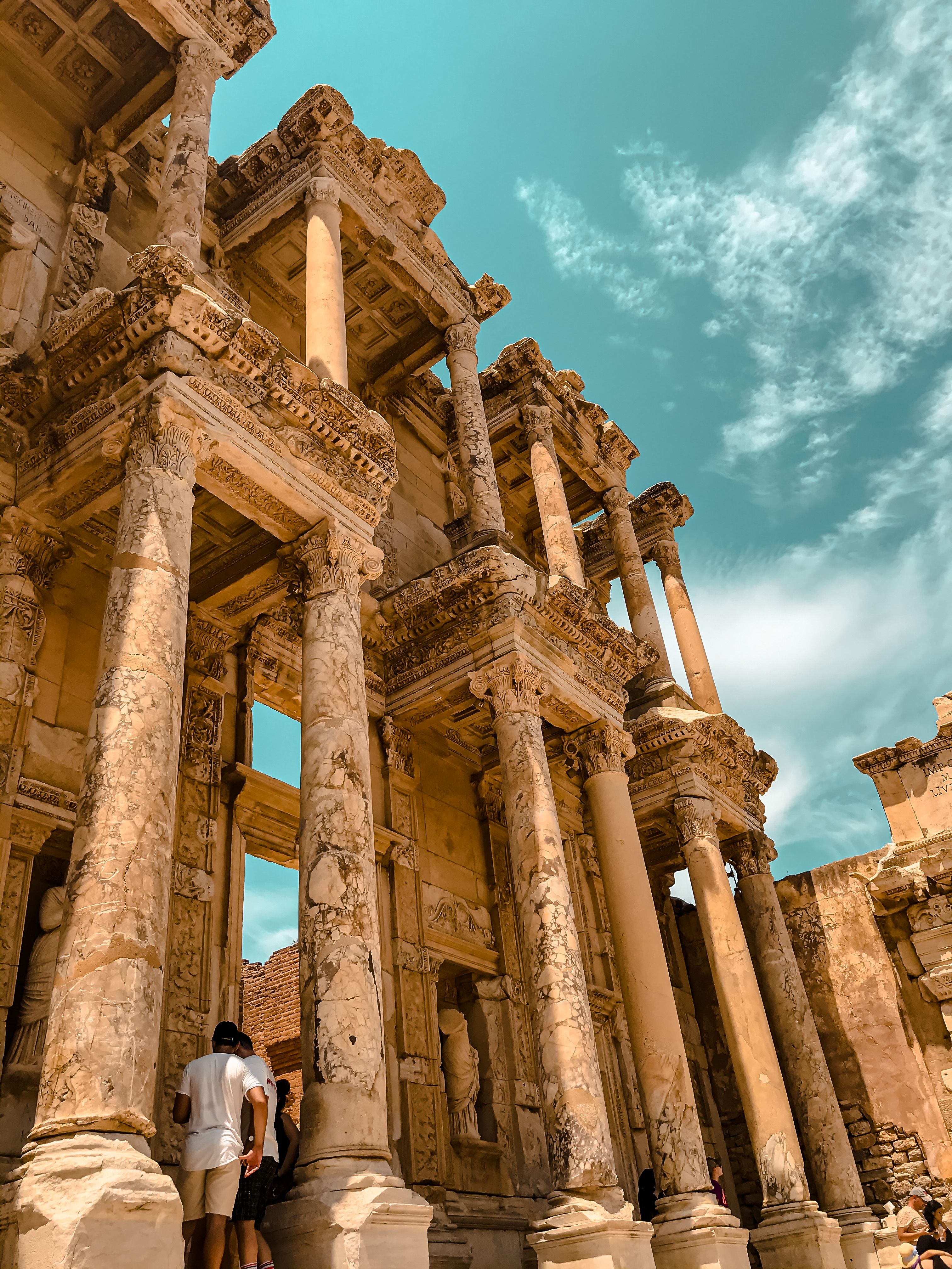 People Standing Under the Ruins · Free Stock Photo