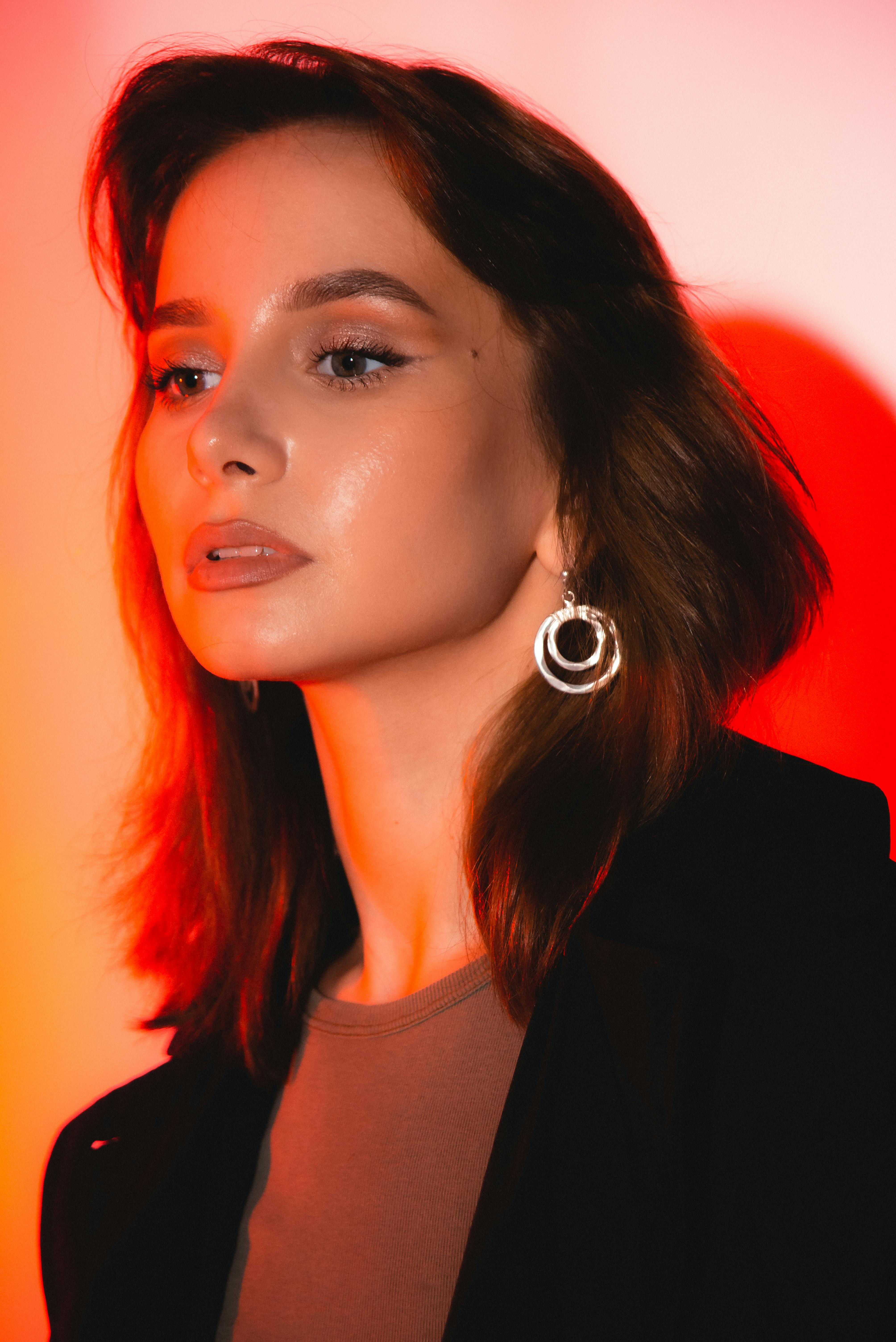 Portrait of a Woman in Dark Red Light · Free Stock Photo