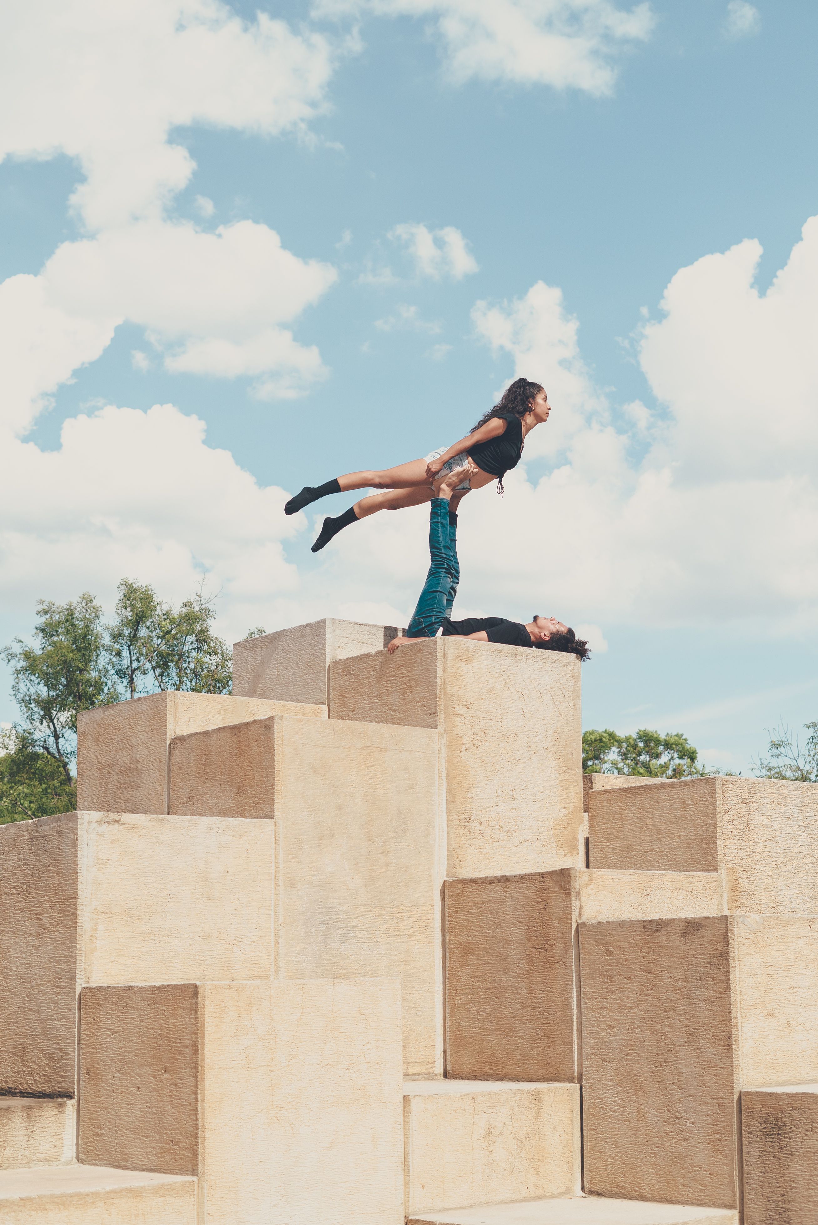 A Man Lifting a Woman with His Feet · Free Stock Photo