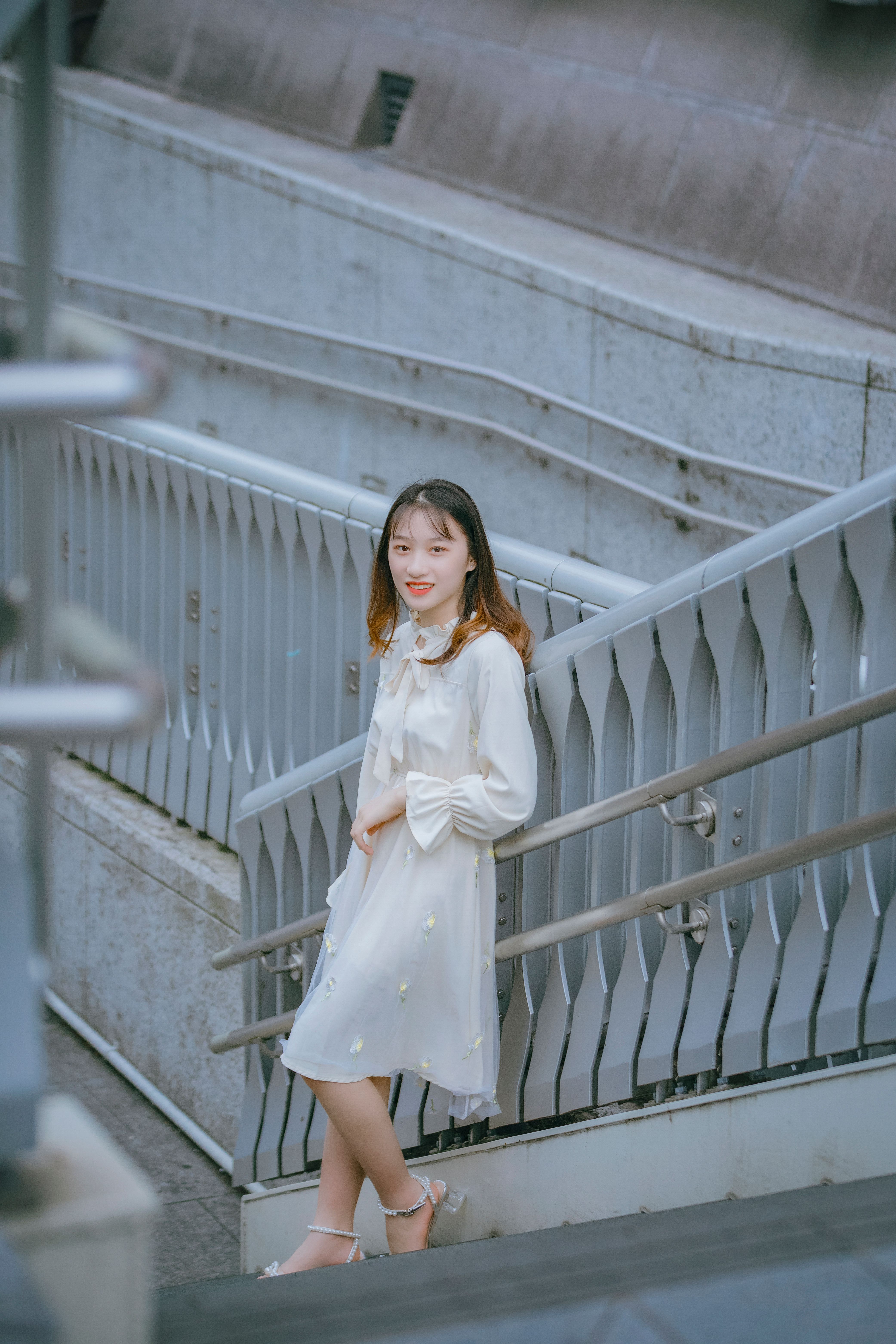 A Back View of Women Standing at the Balcony · Free Stock Photo