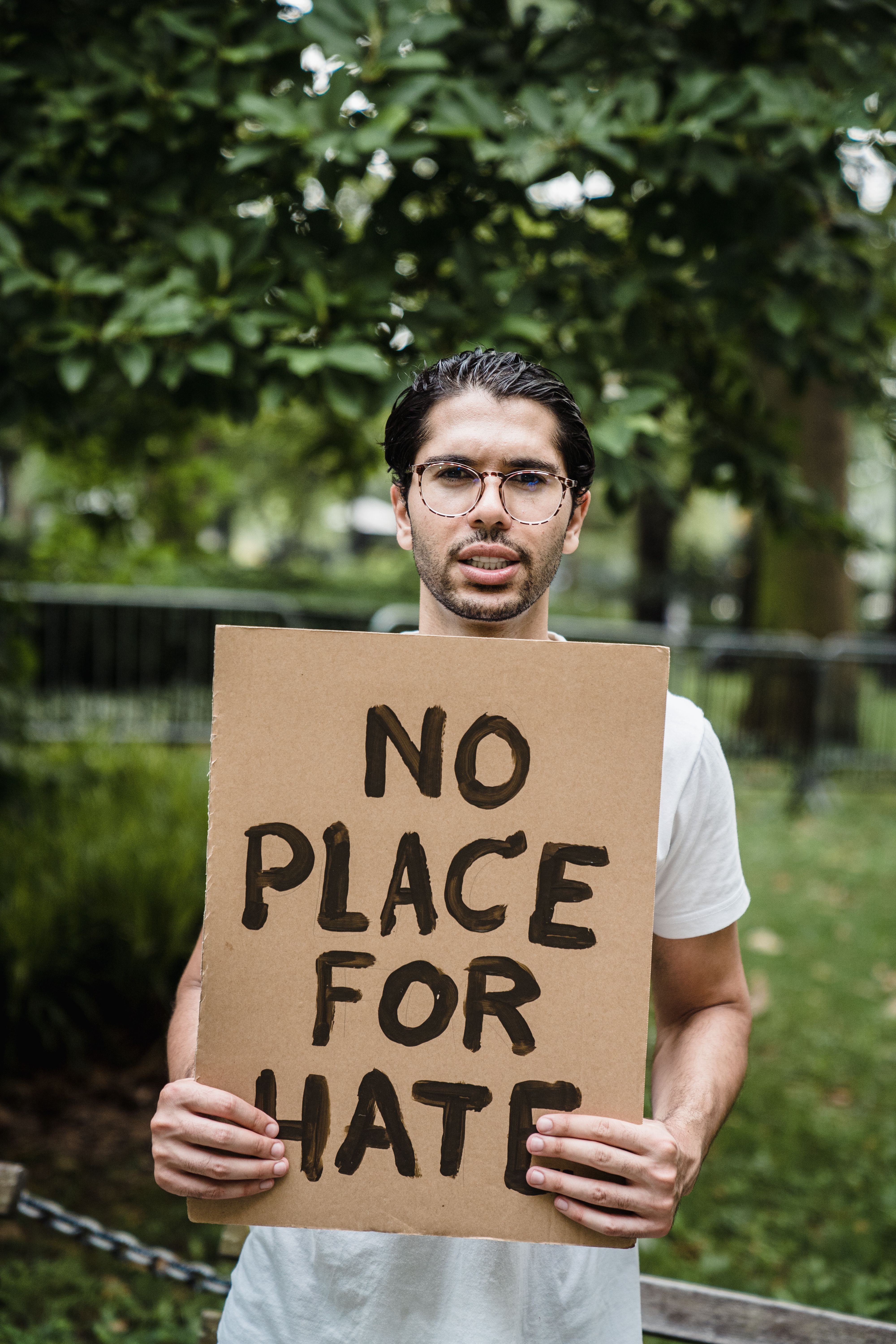 A Man Holding a Placard · Free Stock Photo