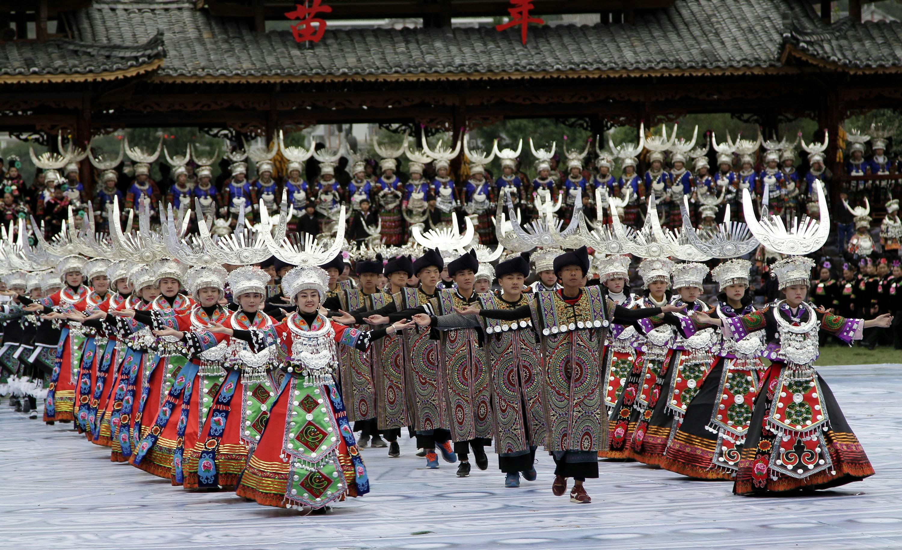 Miao Women in Traditional Clothes Standing in Line · Free Stock Photo