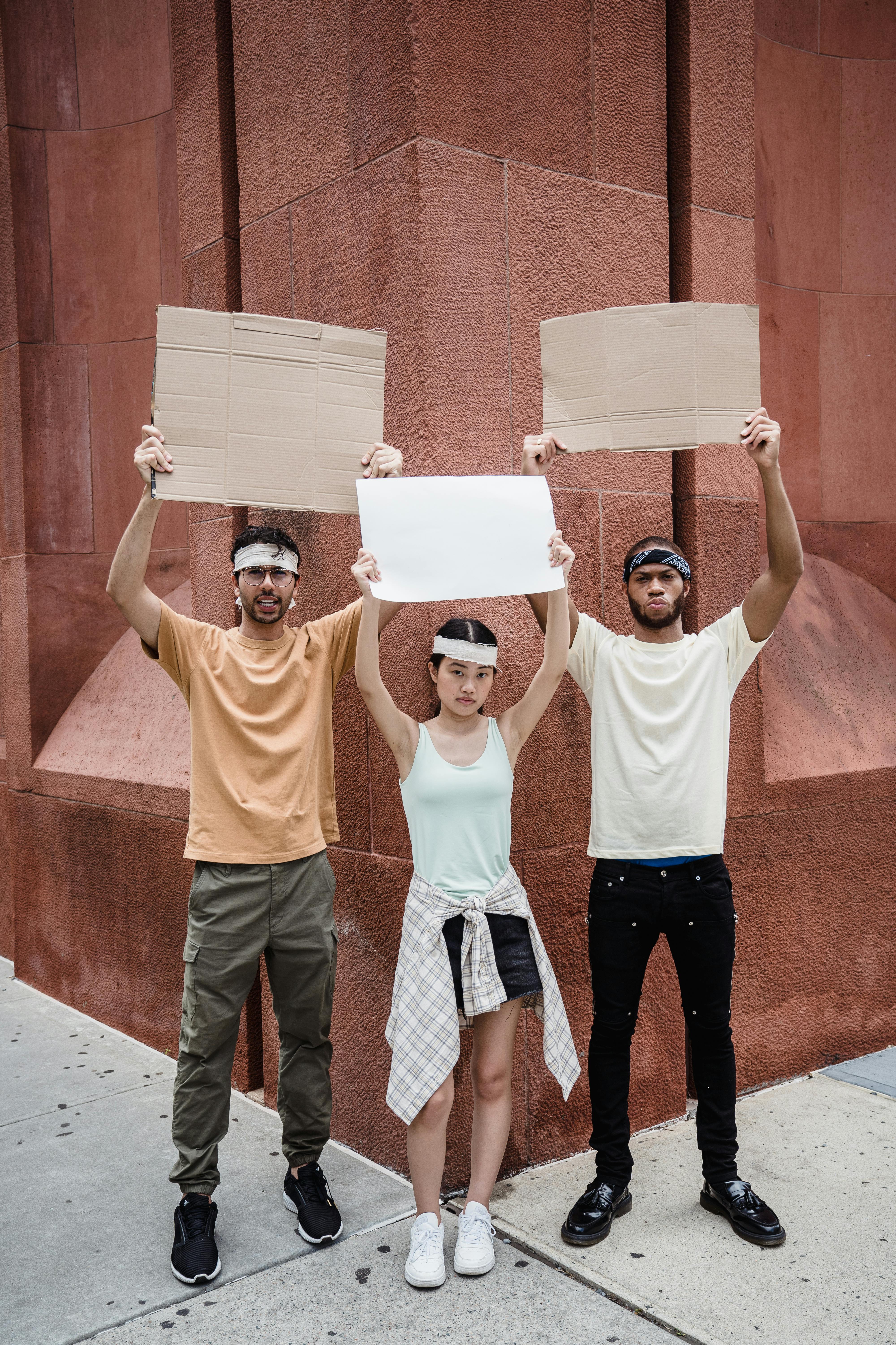People with Mockup Posters on Street Demonstration · Free Stock Photo