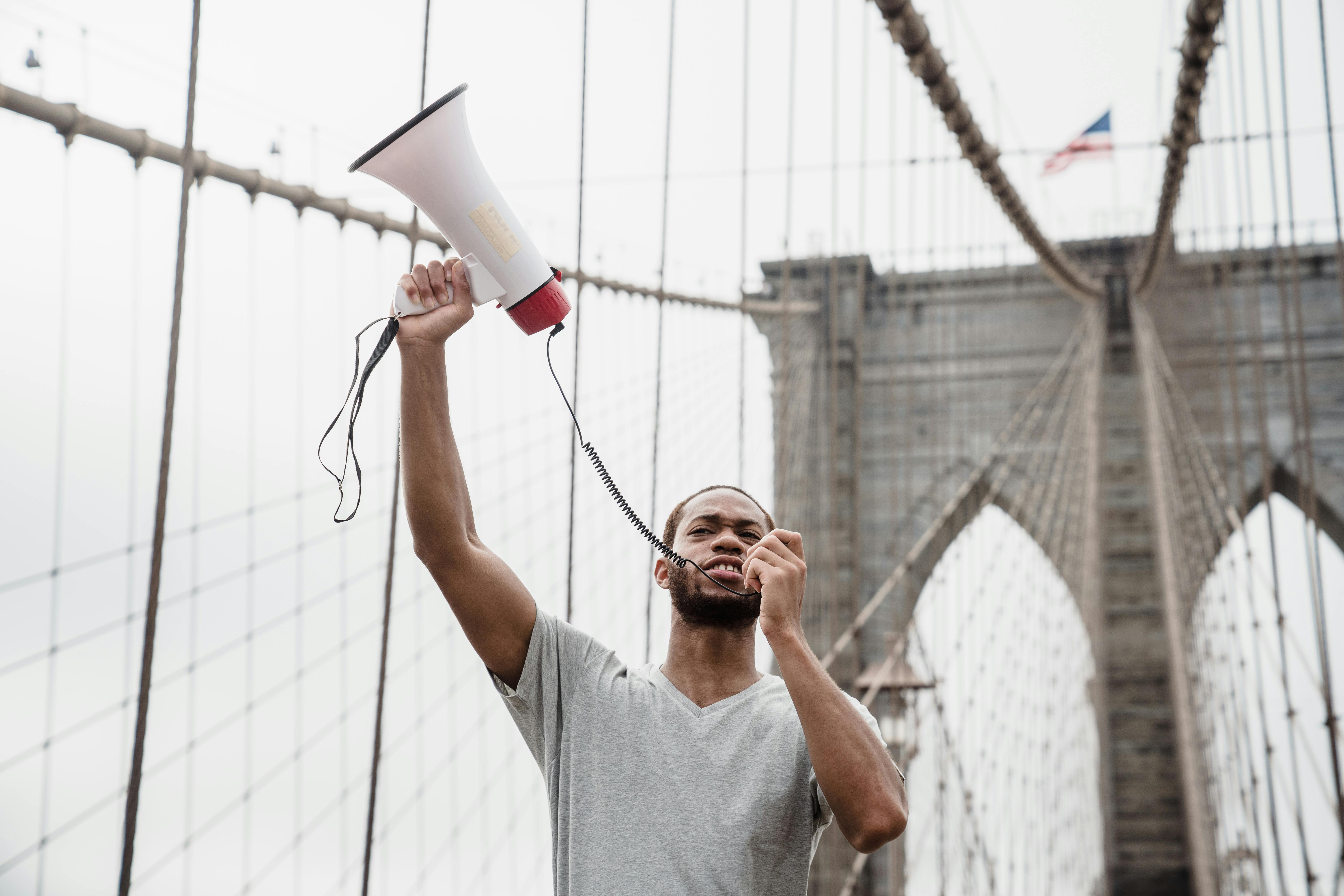 Man Protesting on Brooklyn Bridge · Free Stock Photo