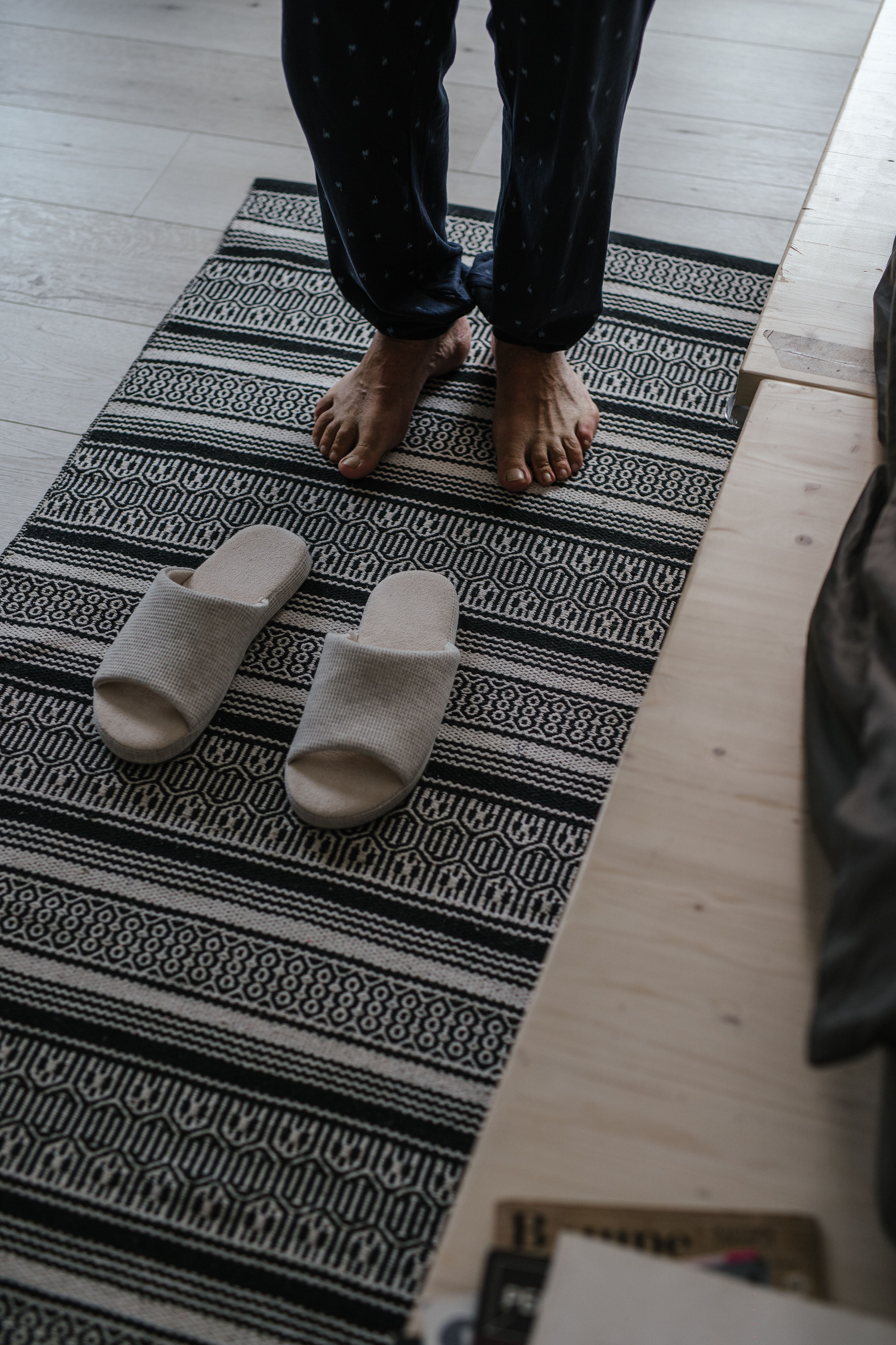 Person Standing Near Slippers · Free Stock Photo