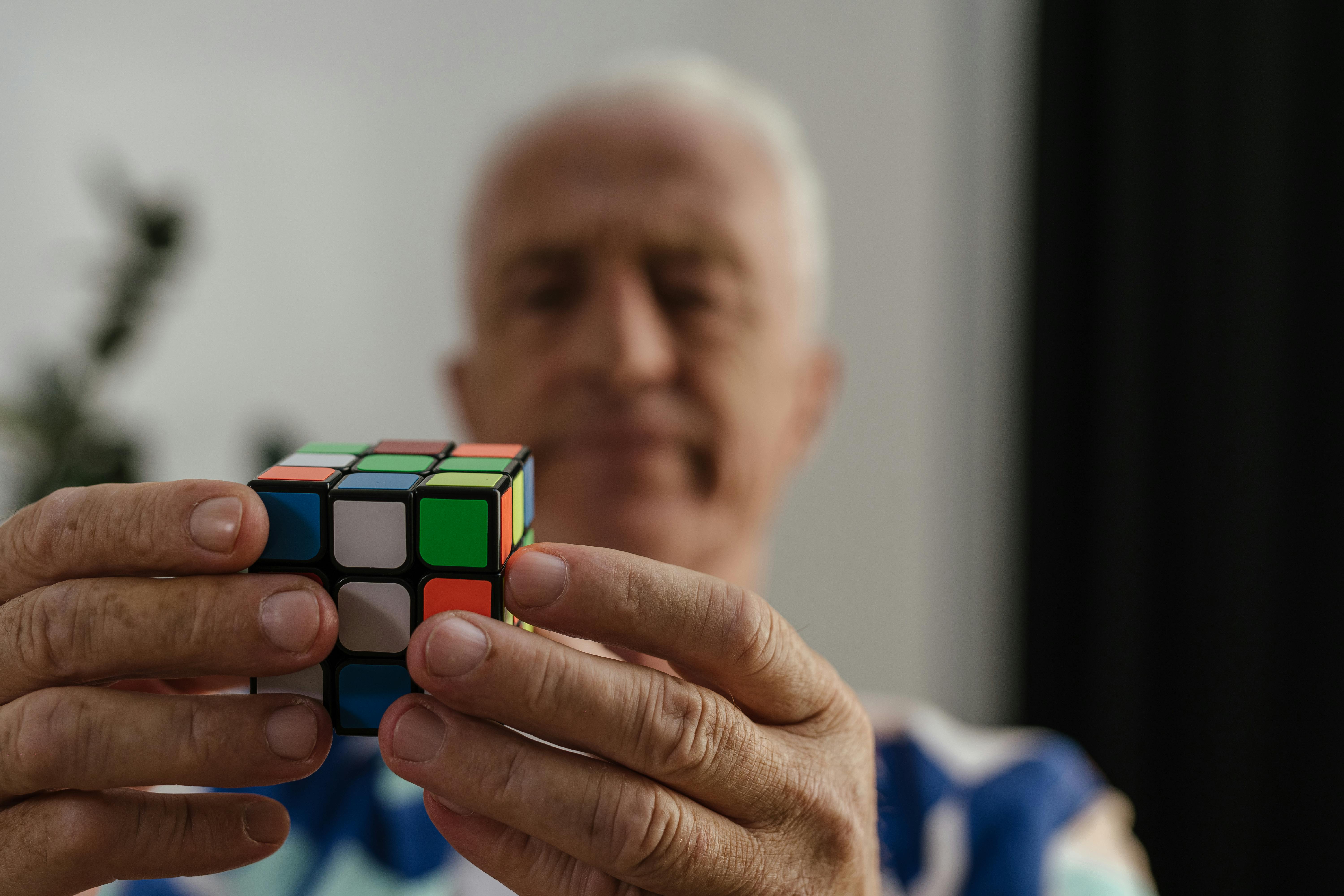 Person Holding Rubik's Cube · Free Stock Photo