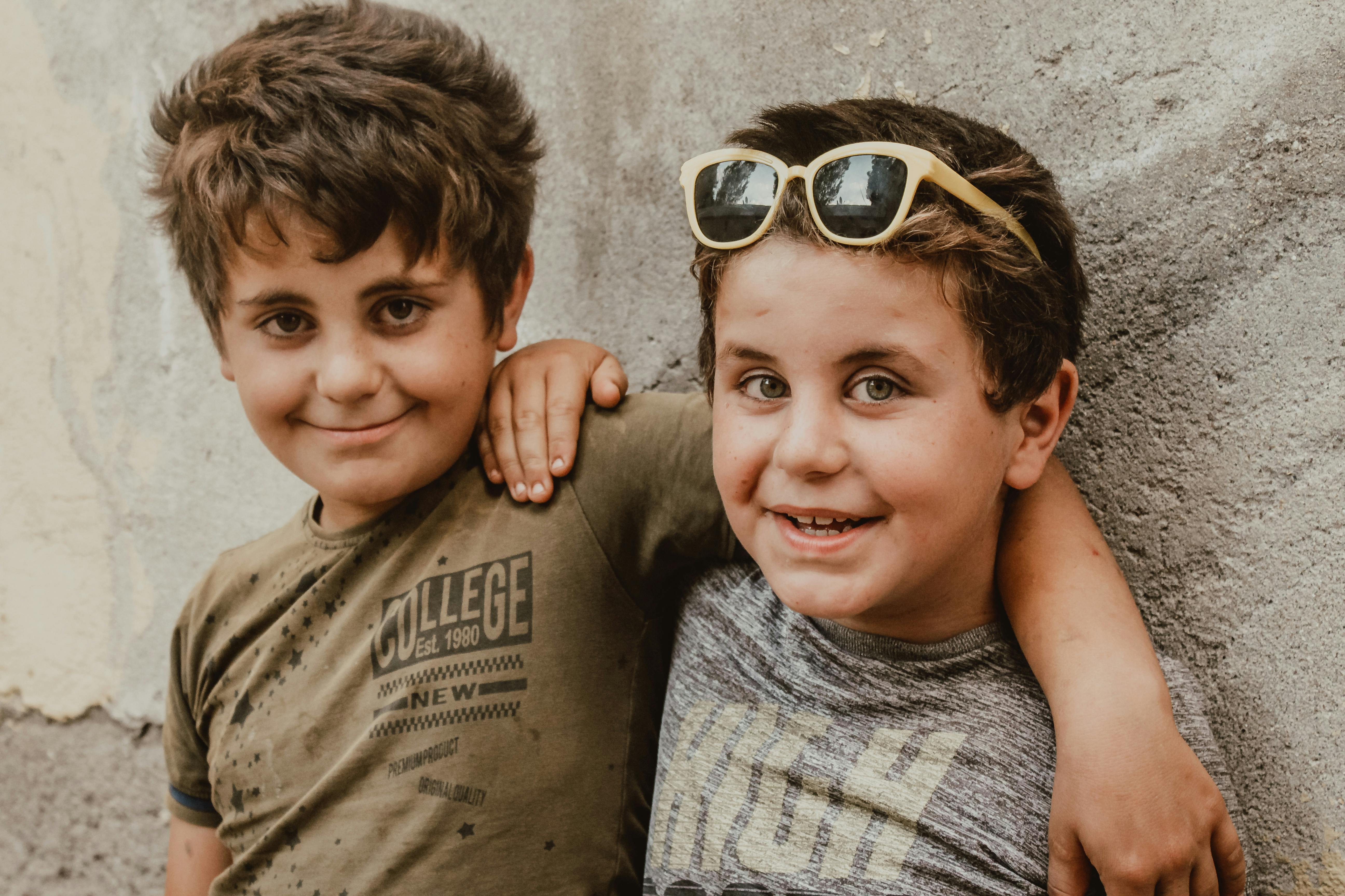 Two Young Monks Standing next to Each Other · Free Stock Photo