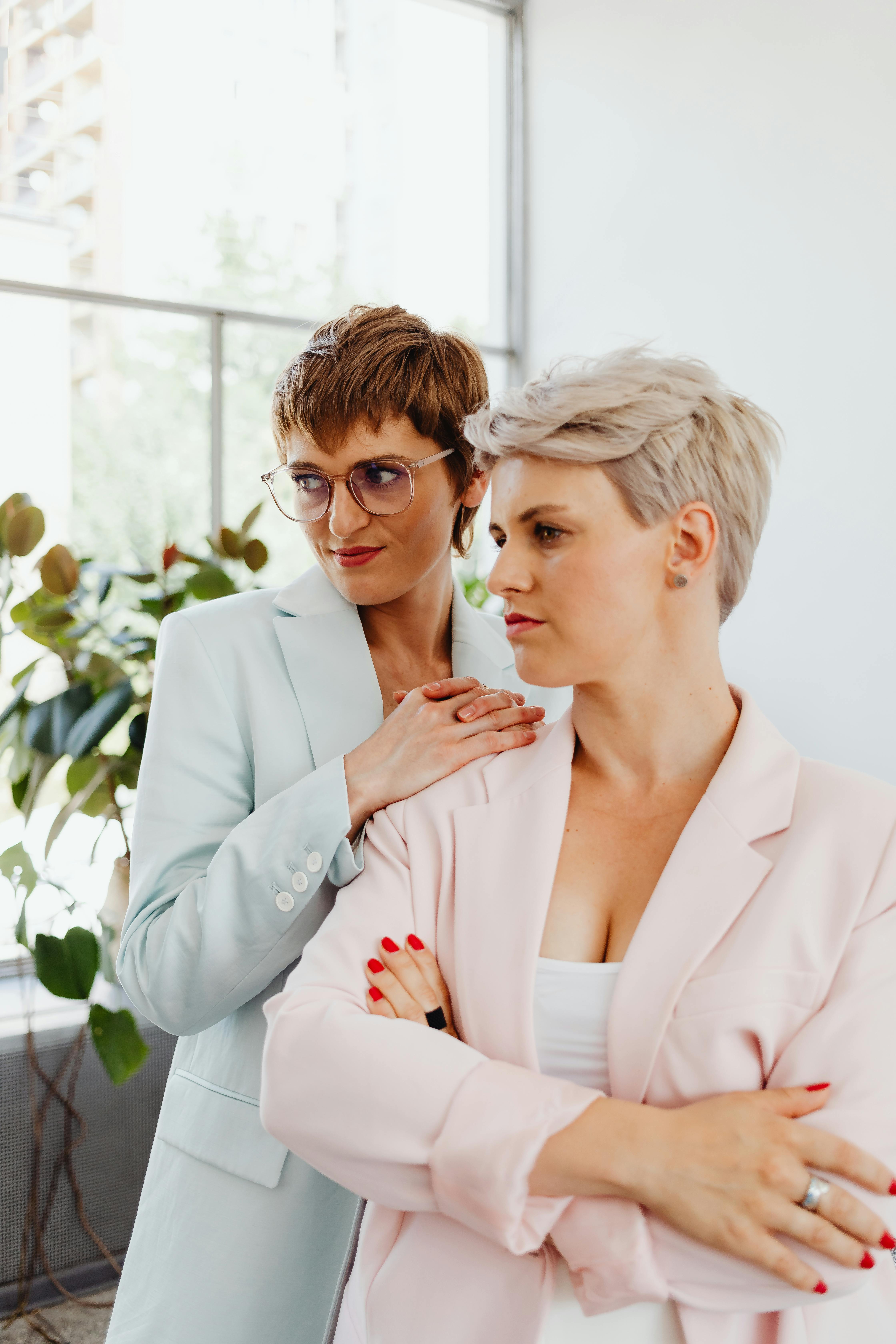 Women in Blazers Standing Close to Each Other · Free Stock Photo