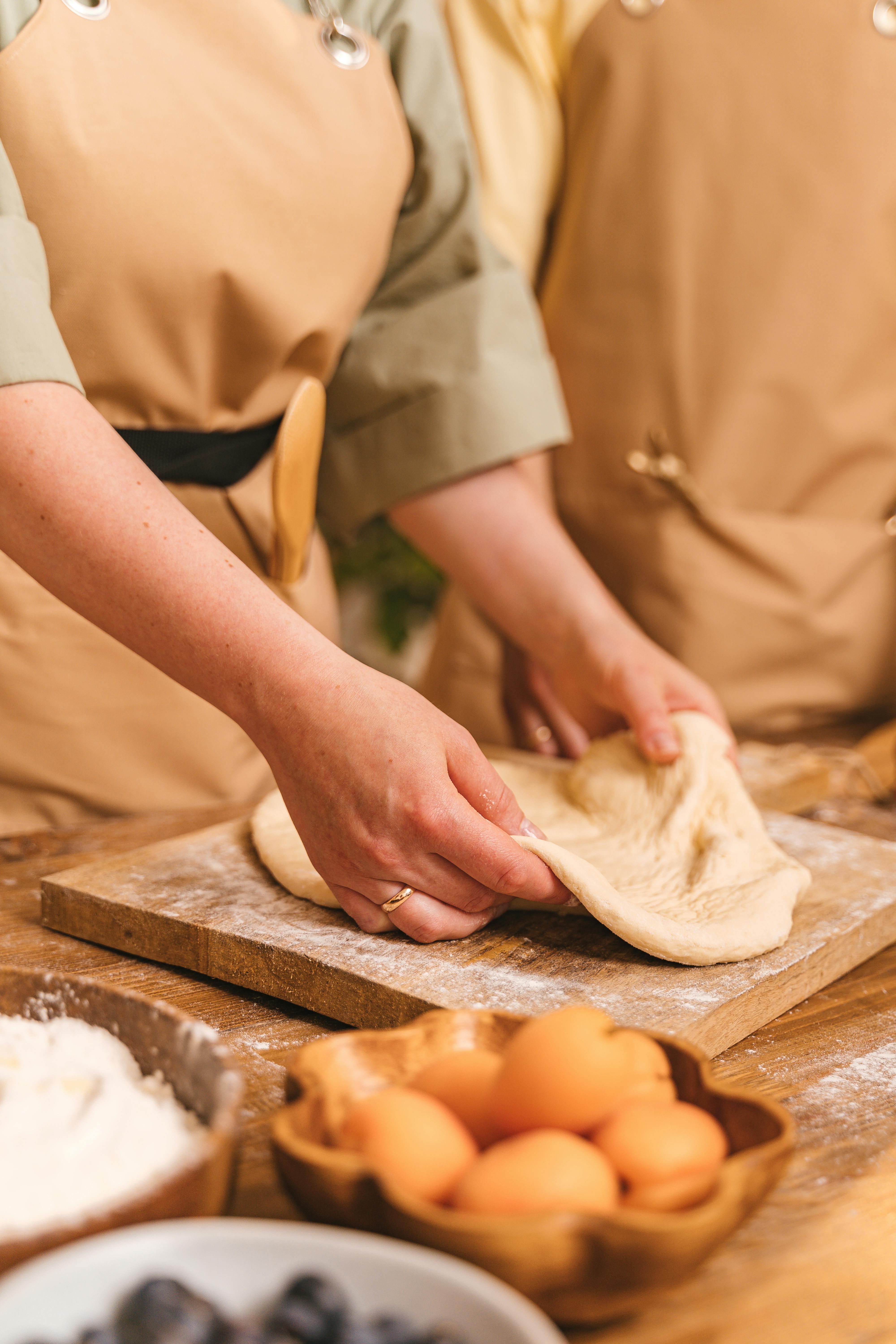 Person Kneading a Dough · Free Stock Photo