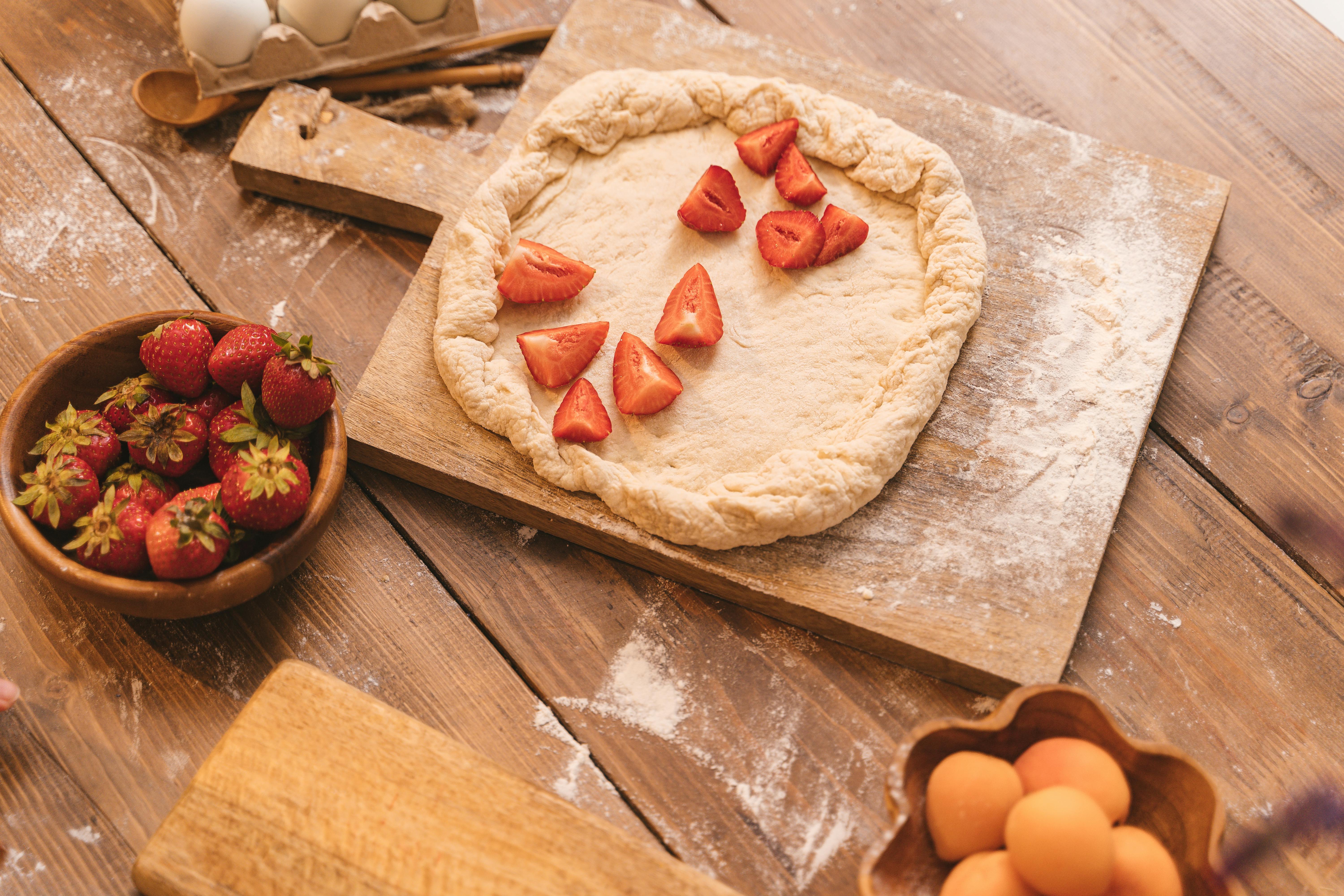 Decorating Dough with Fruits for Pie · Free Stock Photo