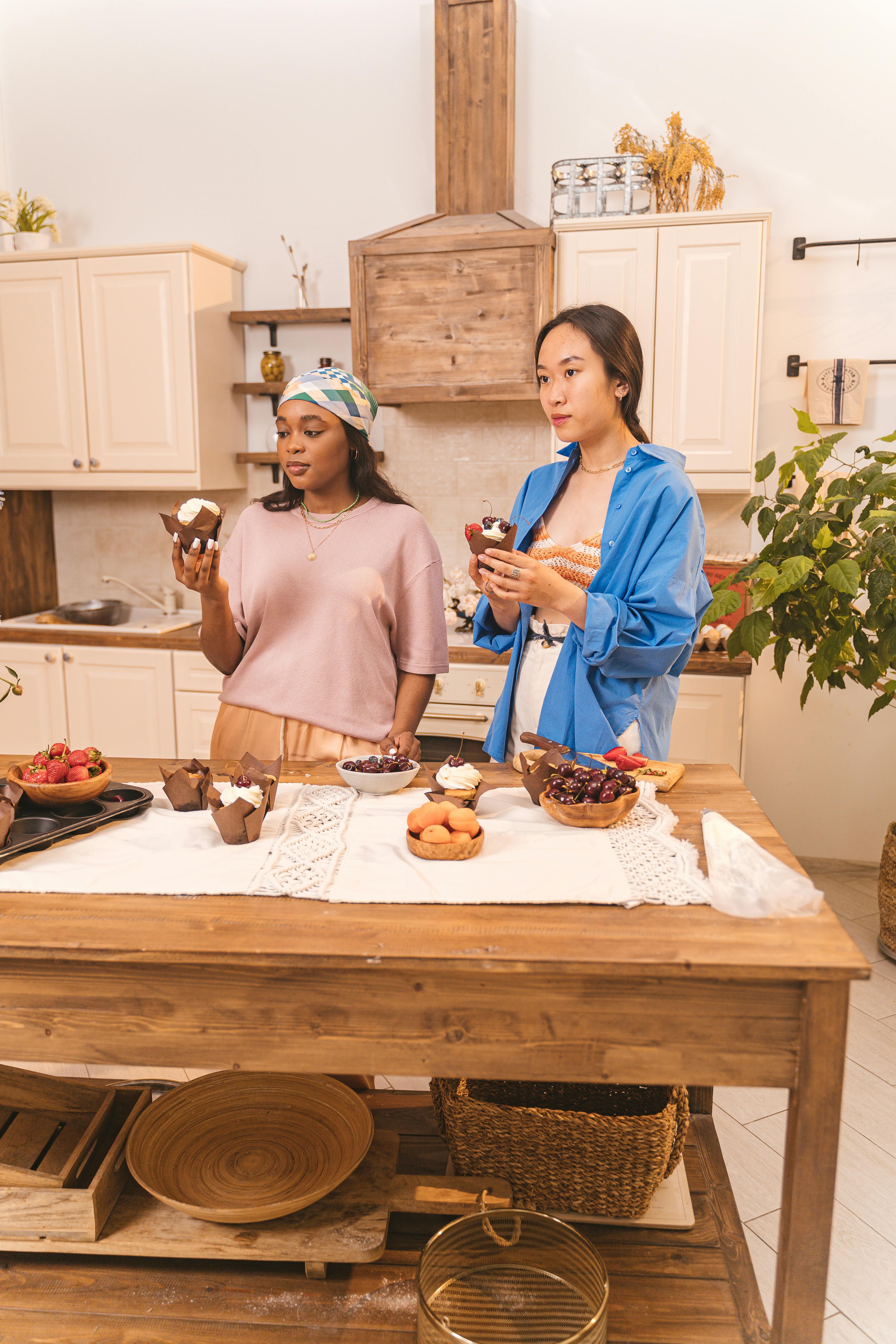 Women Standing at the Table · Free Stock Photo