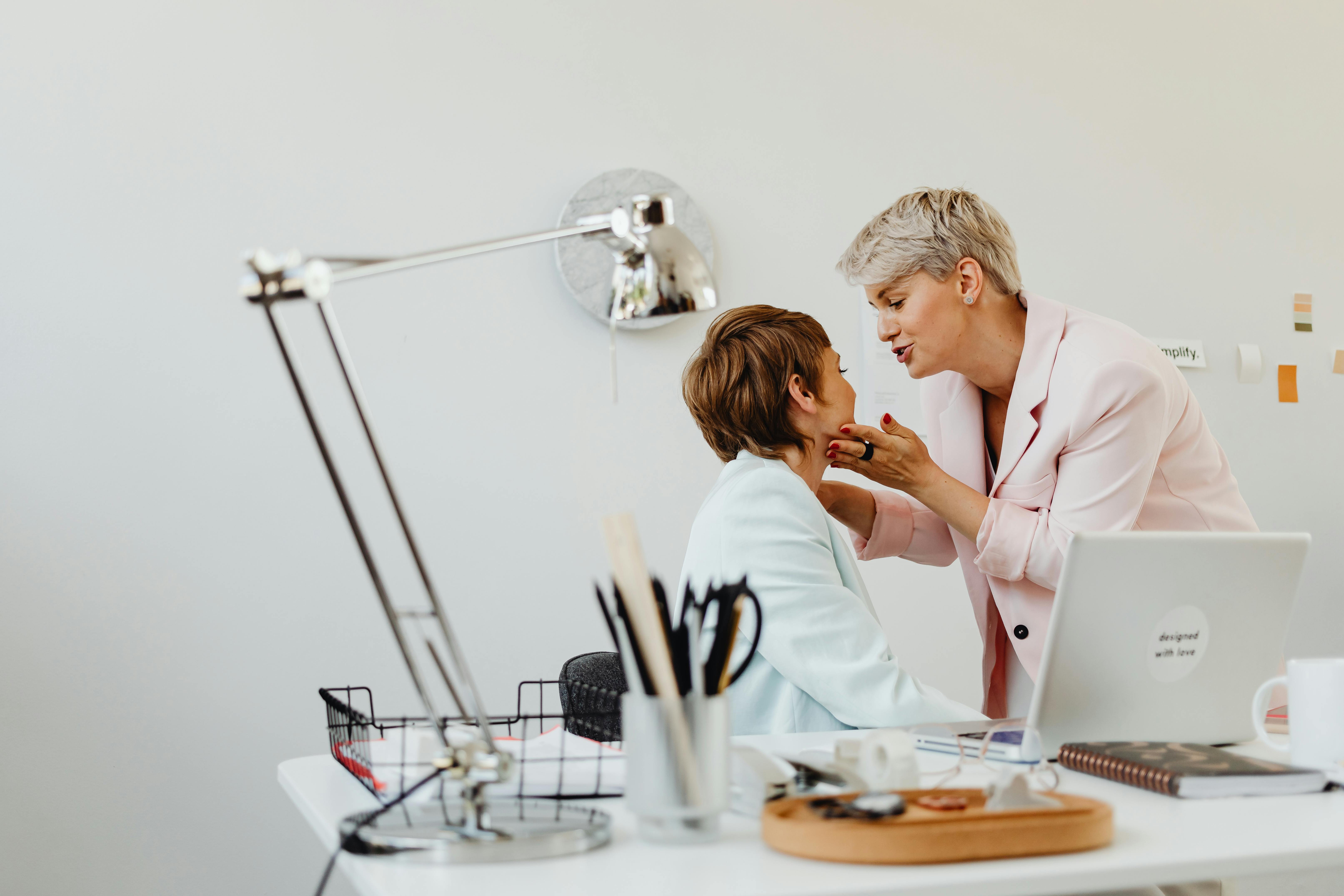 An Intimate Couple in the Office · Free Stock Photo