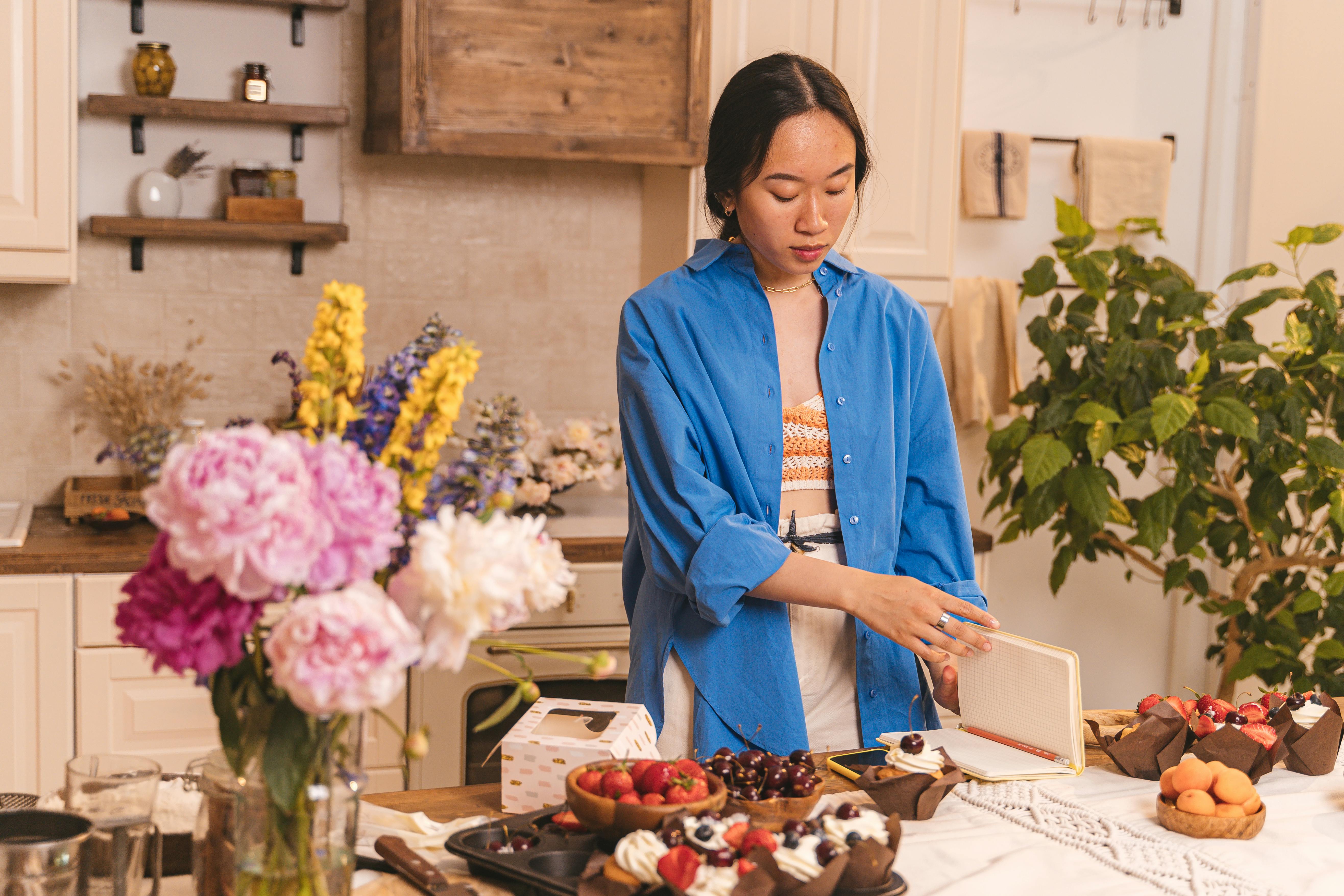A Woman Opening a Notebook · Free Stock Photo