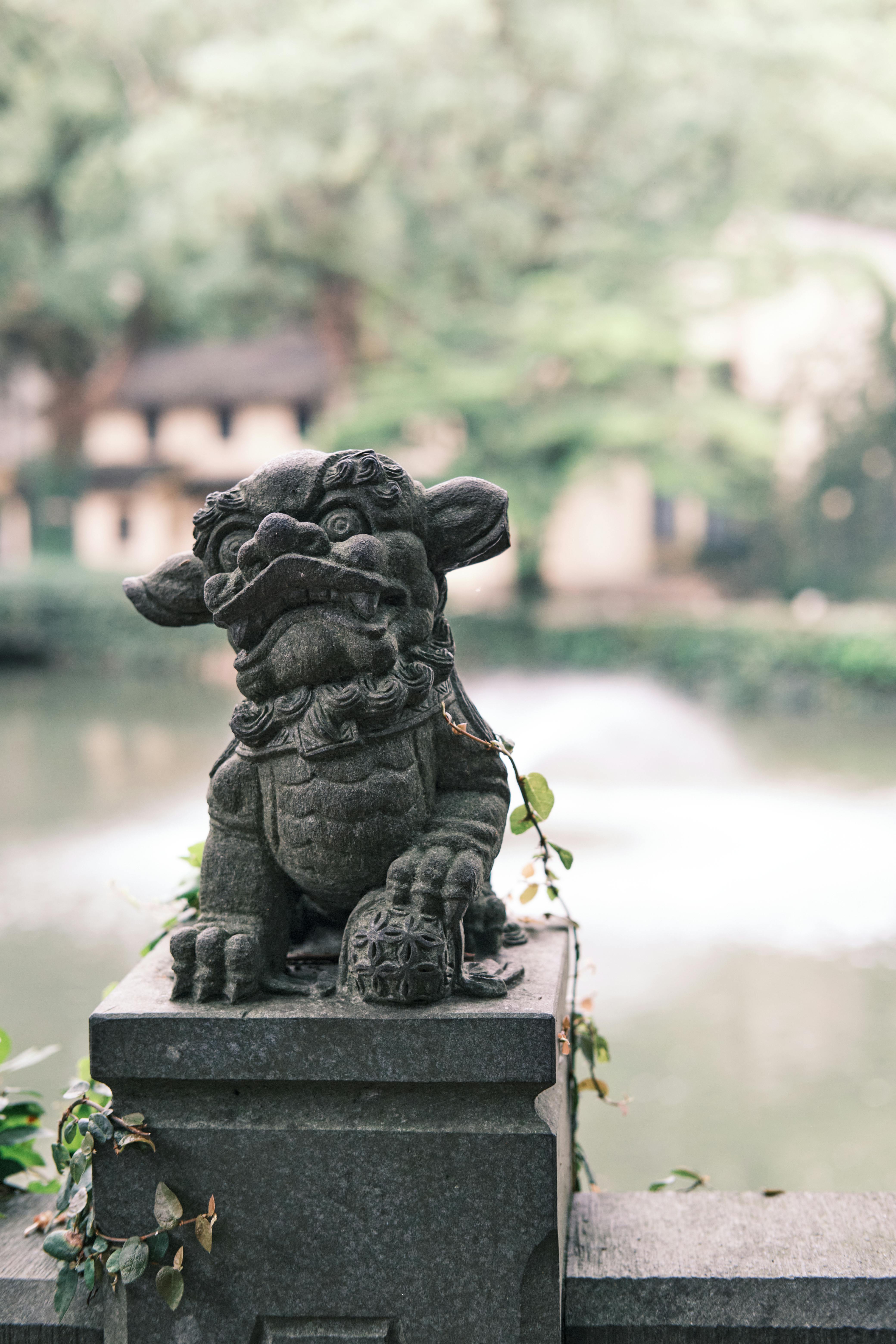Statues on the Wooden Table · Free Stock Photo