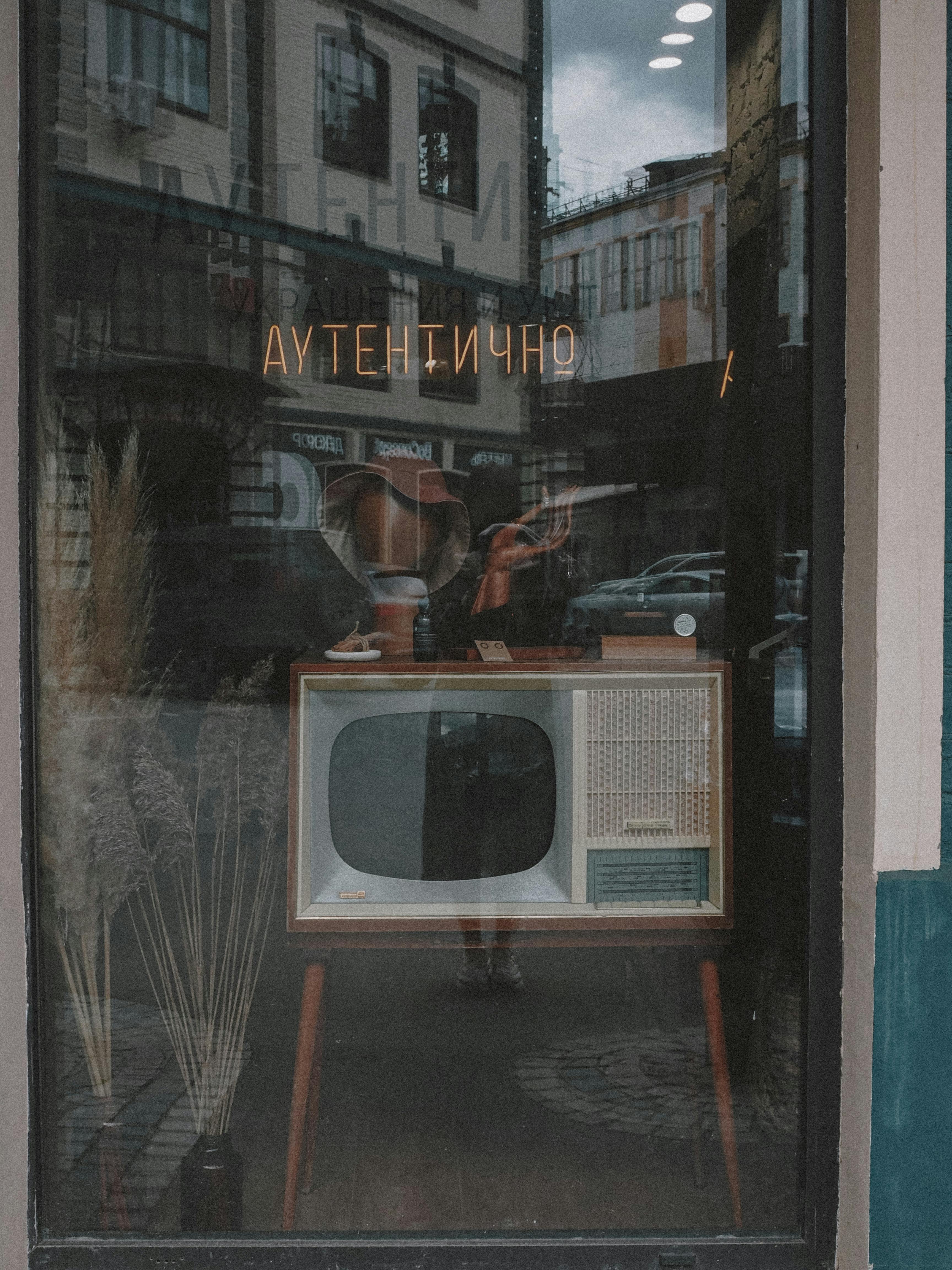 A Vintage Television Set on the Display Window · Free Stock Photo