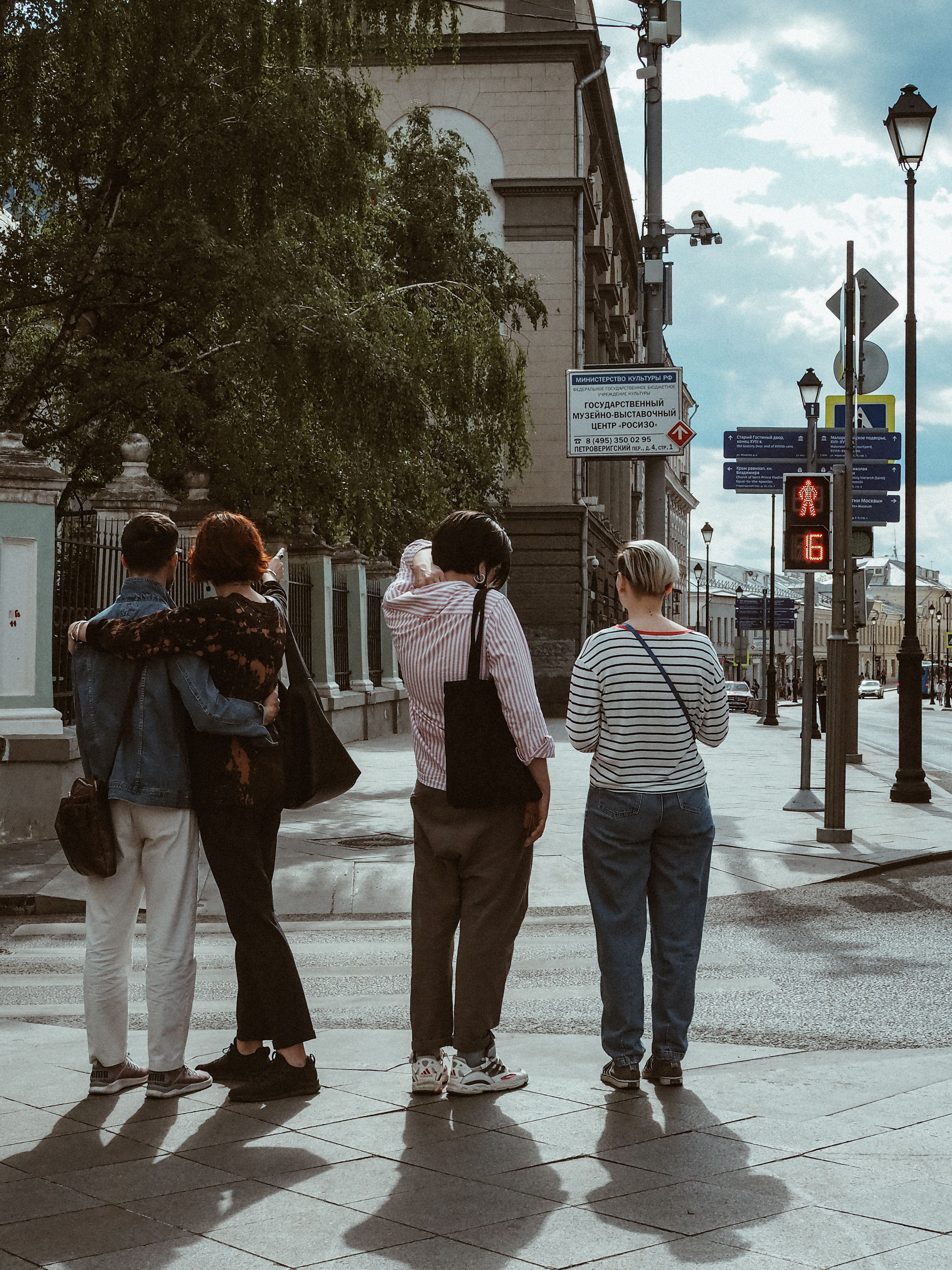 People Standing Near Pedestrian Lane · Free Stock Photo
