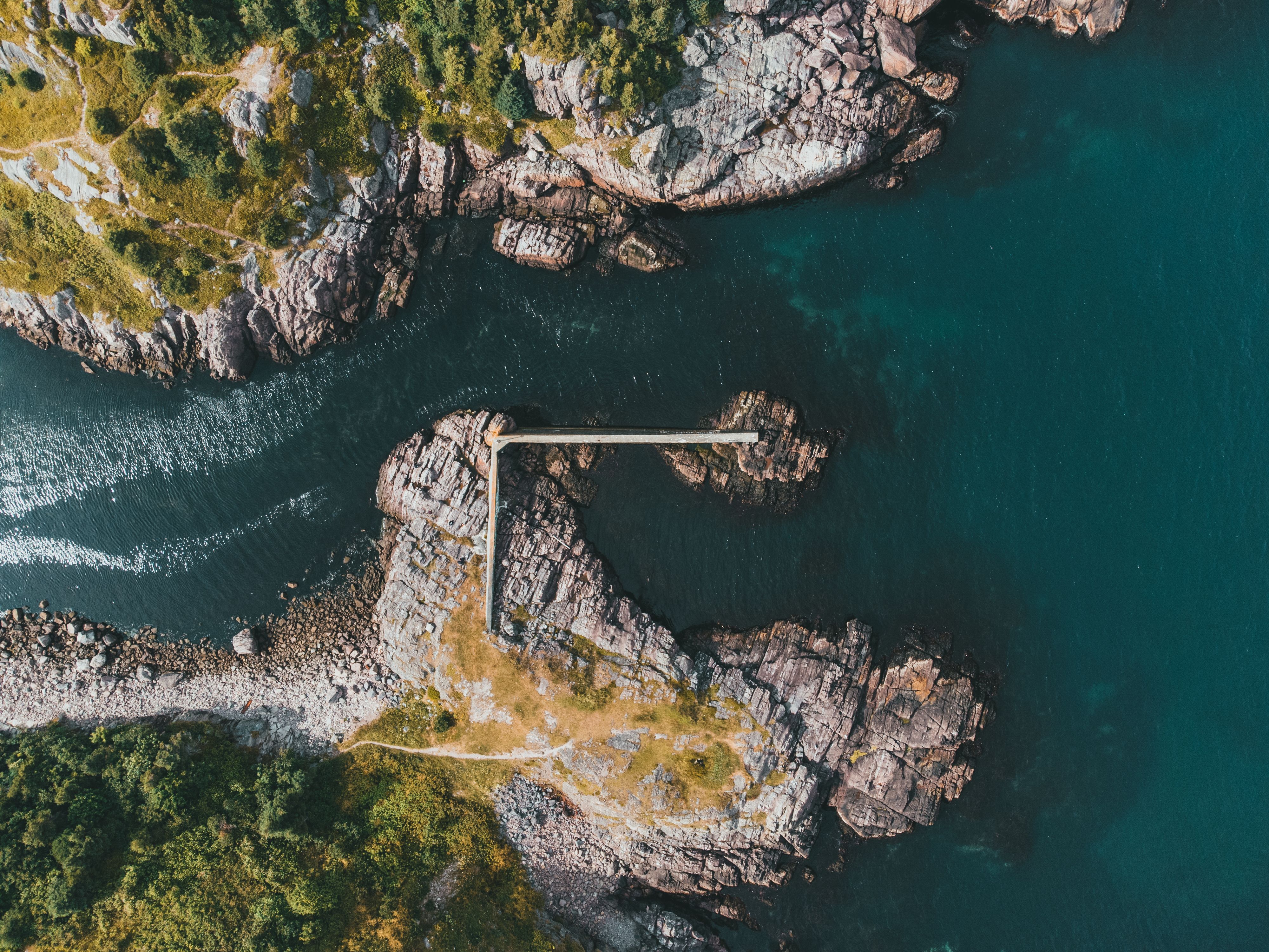 Rock Cliffs in Blue Ocean Water · Free Stock Photo