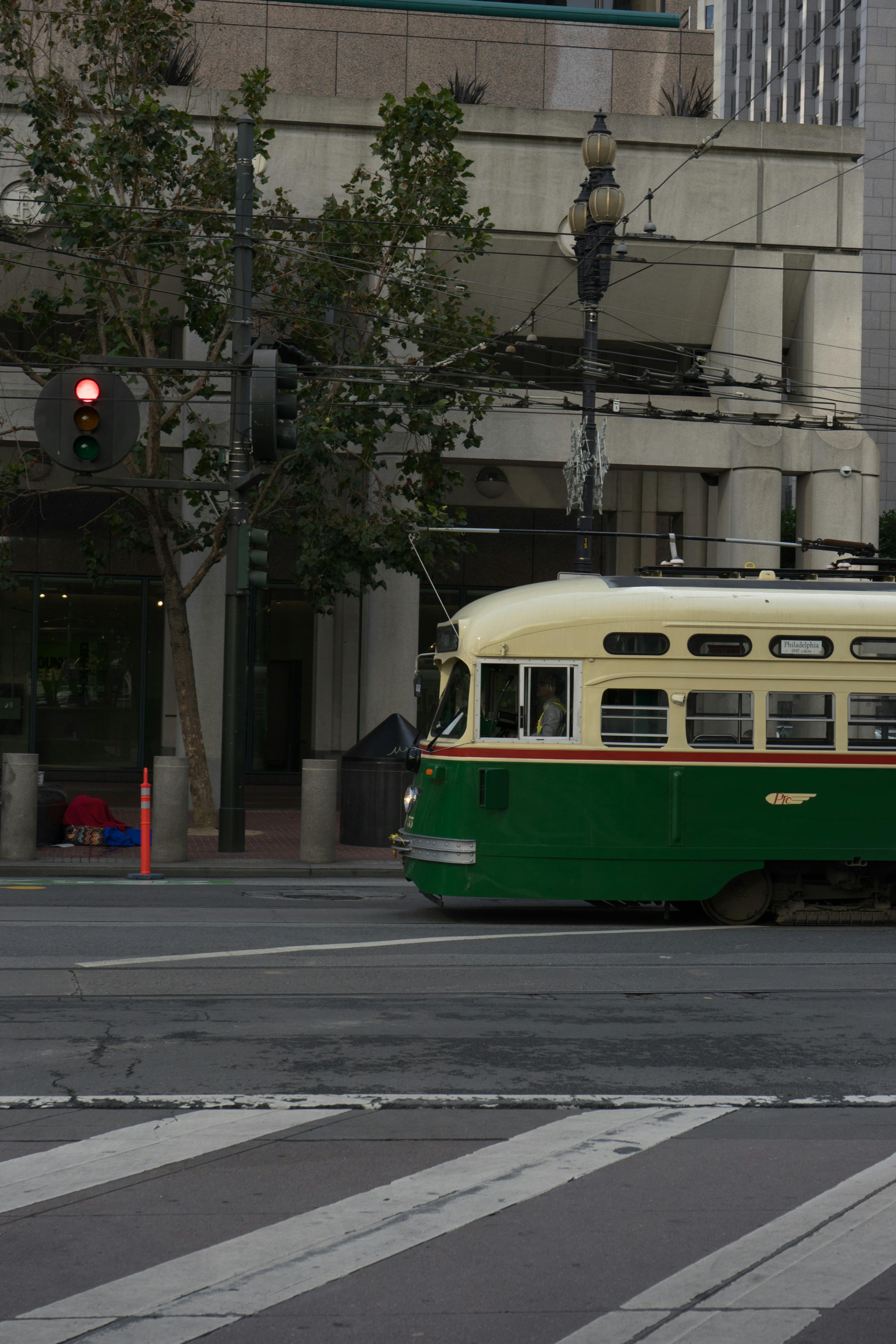 Person Walking In Front Of A Bus · Free Stock Photo