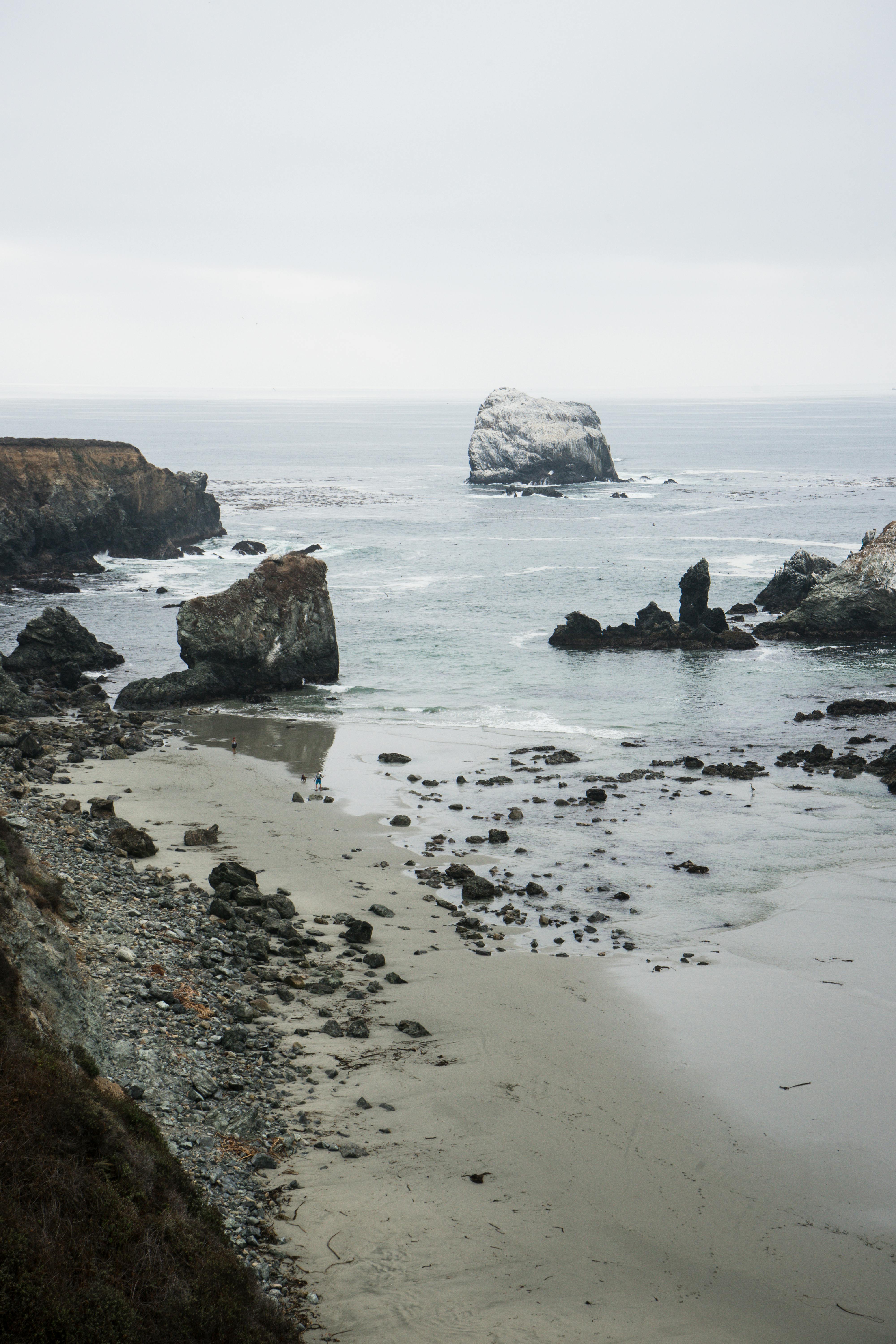 A Rocky Beach Near the Sea · Free Stock Photo