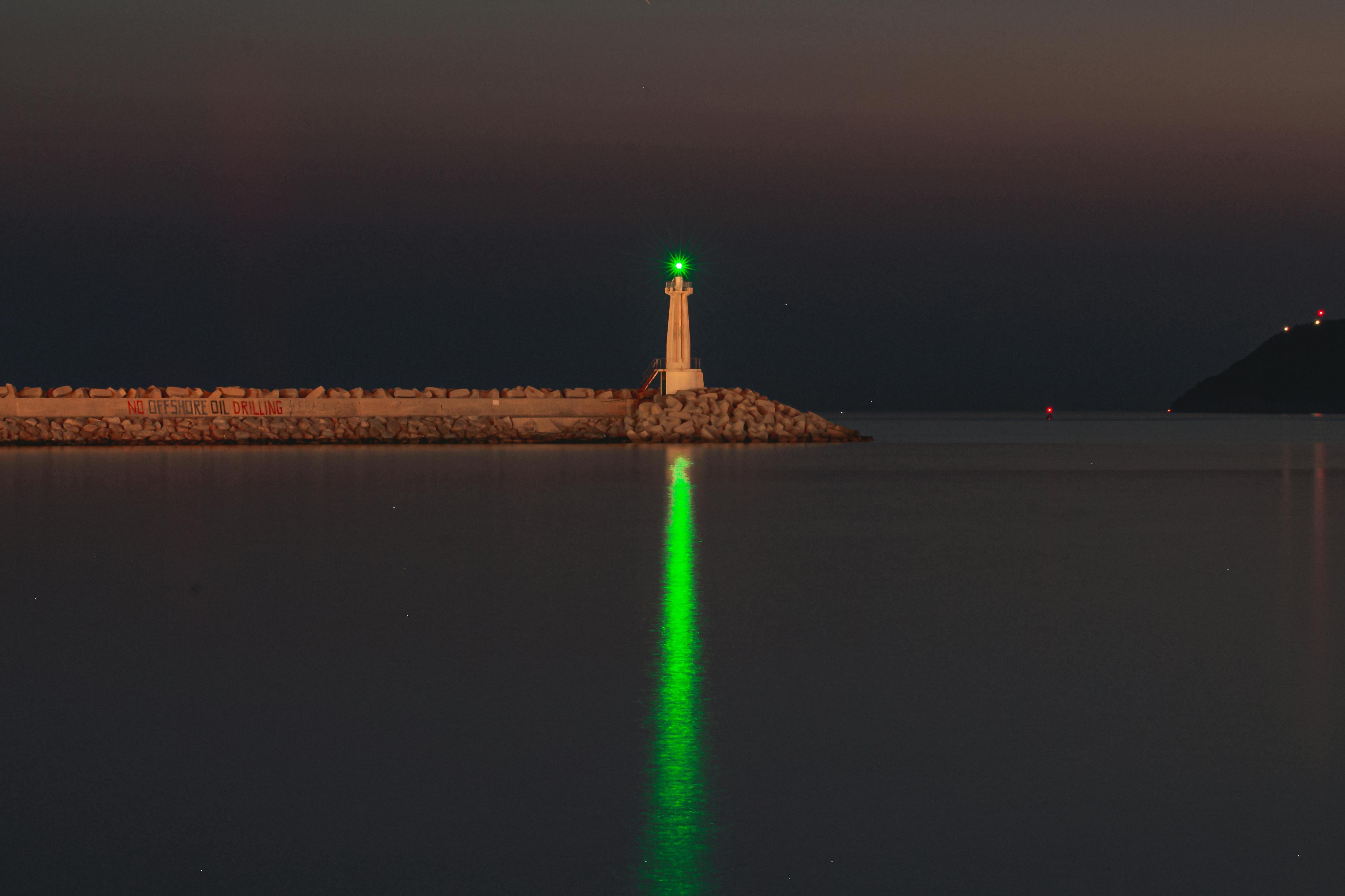 Lighthouse Tower with a Green Light · Free Stock Photo