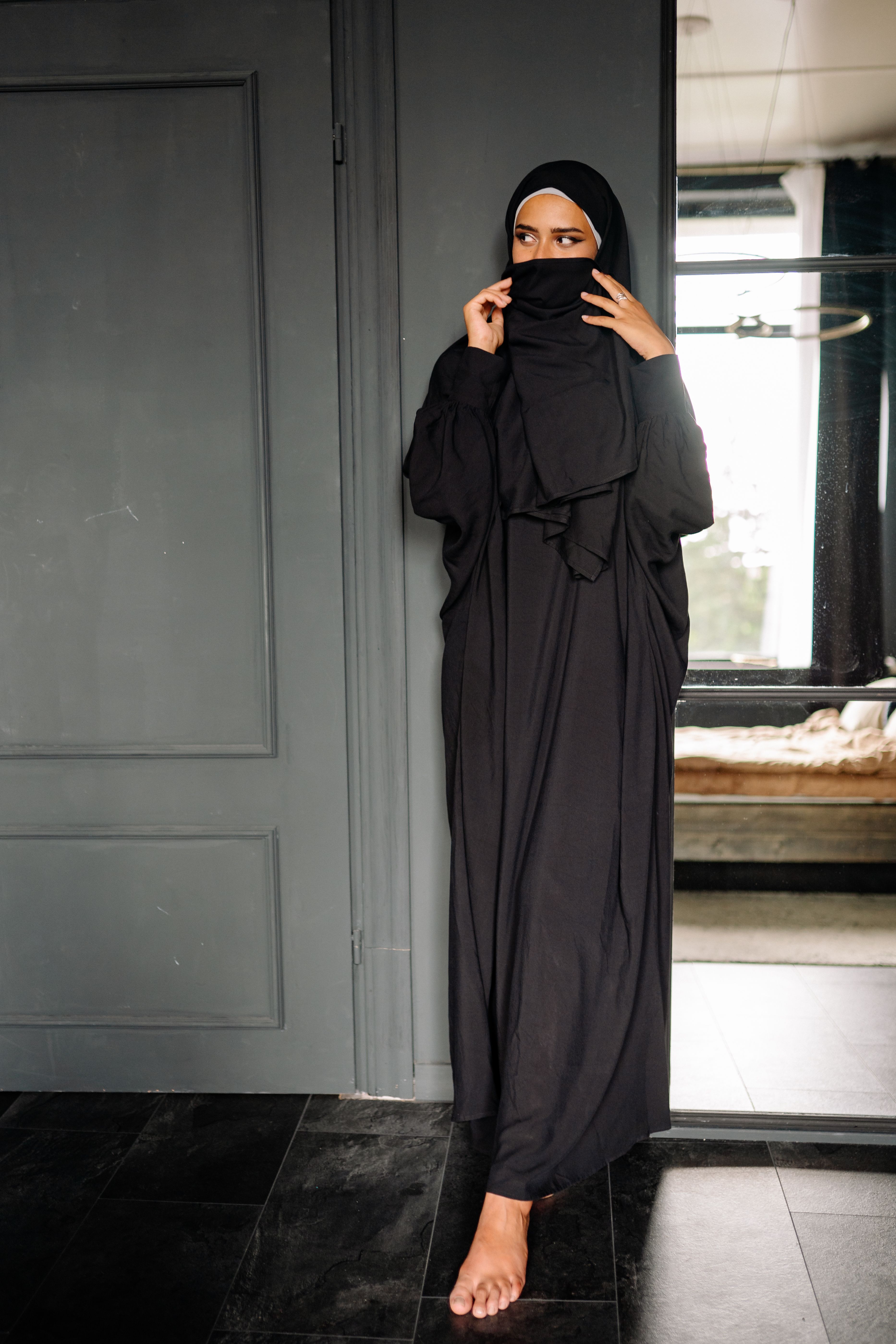 A Low Angle View of a Female Covering Her Face With Her Hand and ...