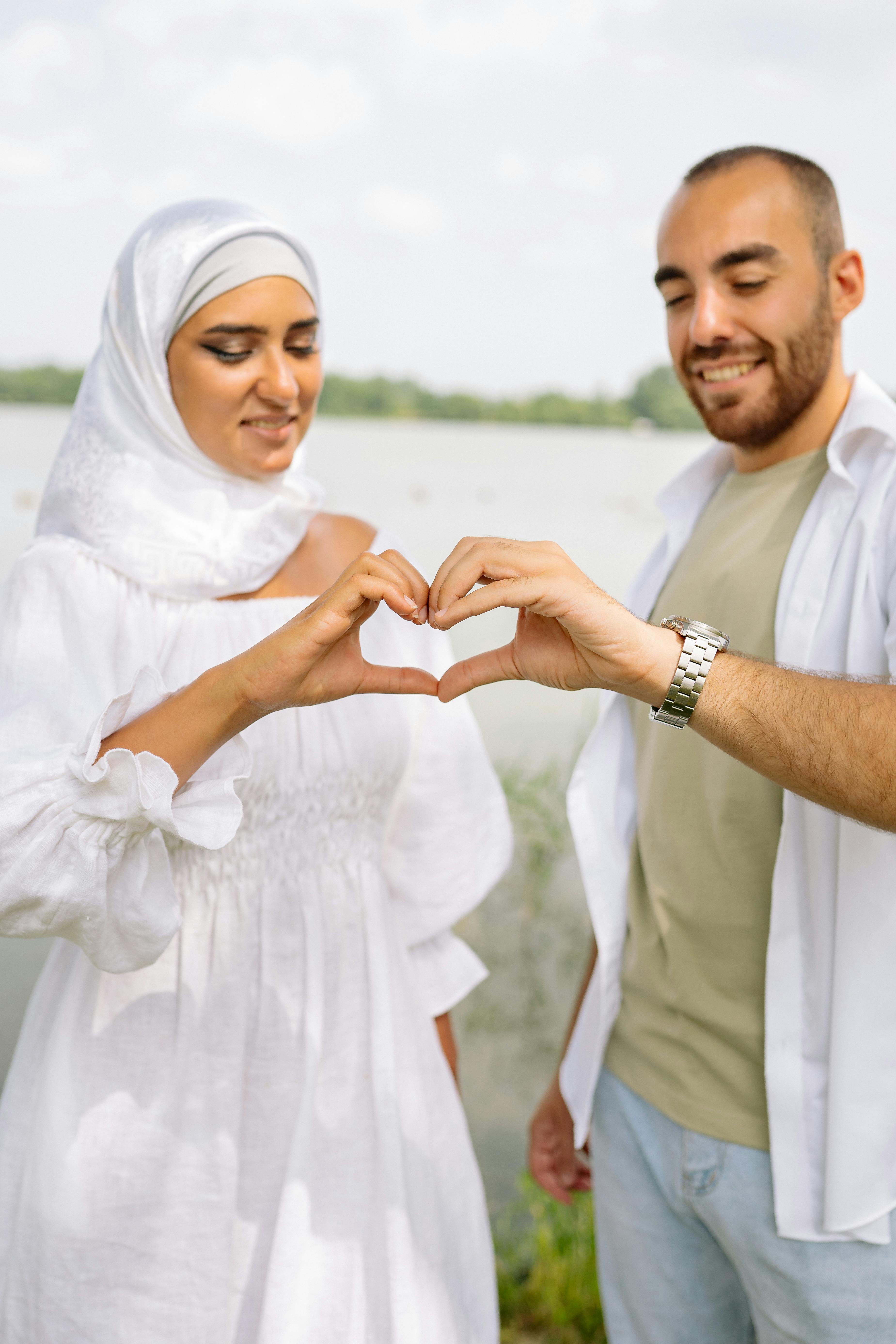Couple Making Heart Shape Using Hands · Free Stock Photo