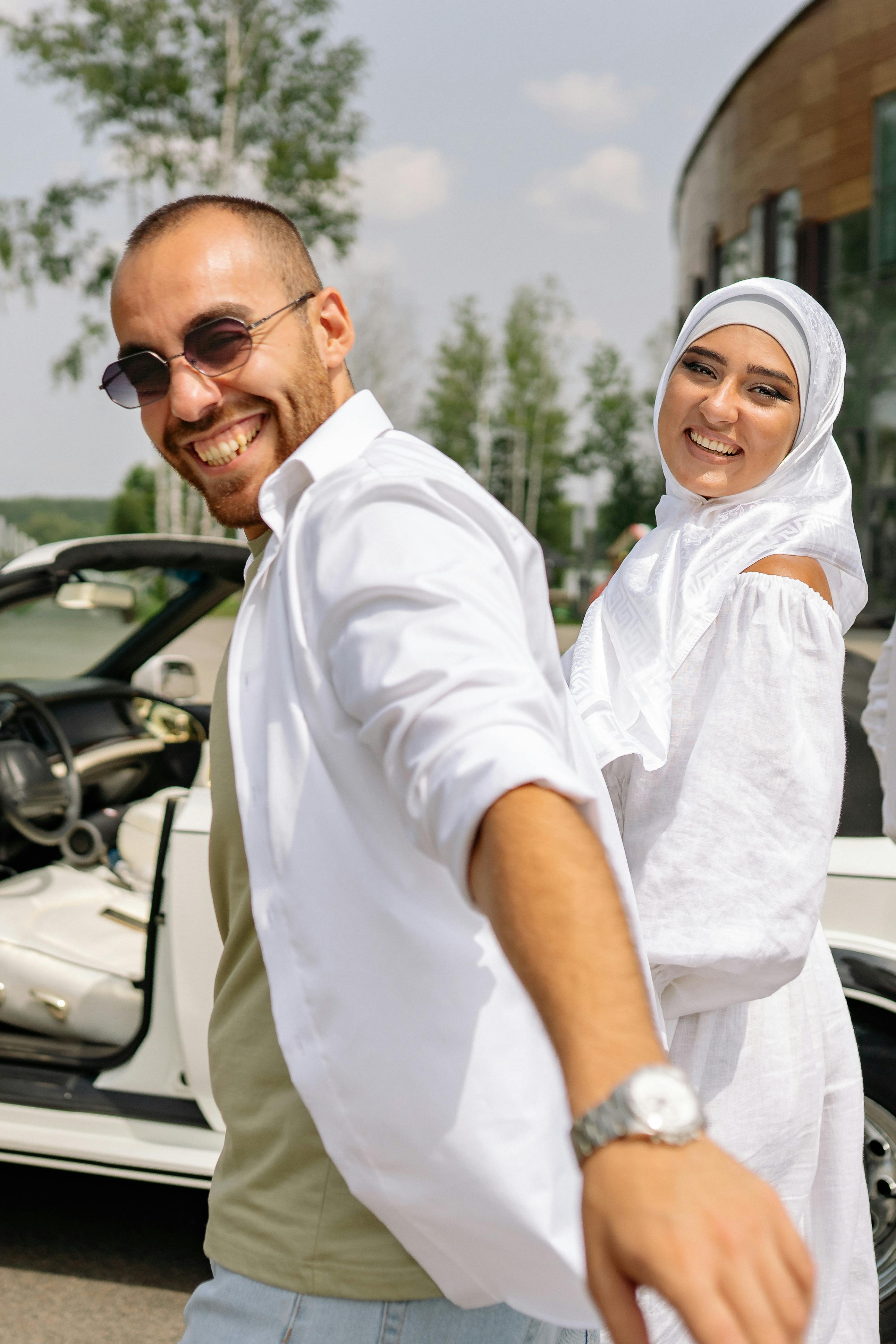 Woman in Hijab Posing in Convertible Car · Free Stock Photo