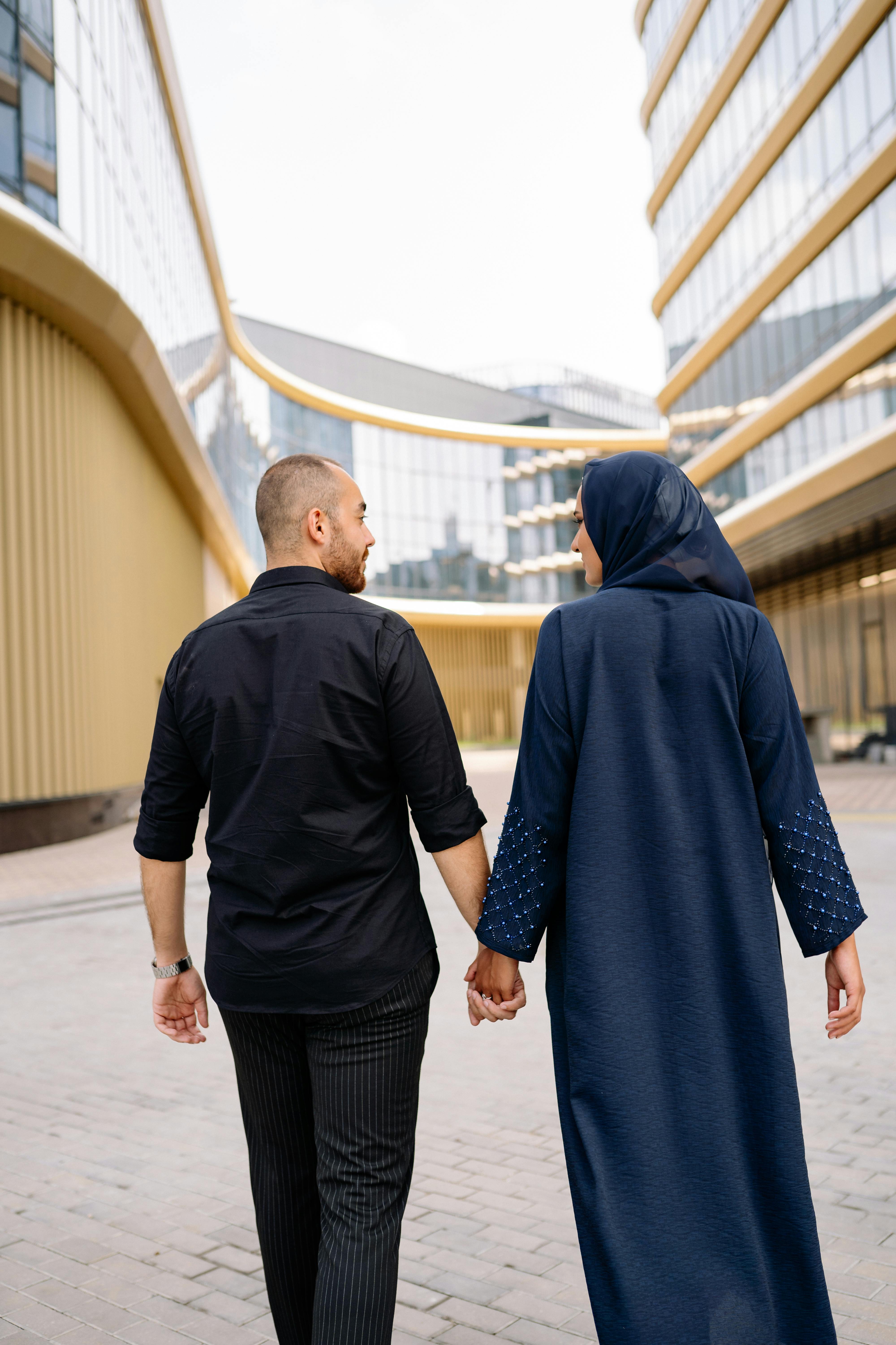 Muslim Couple Looking at City From a Terrace · Free Stock Photo