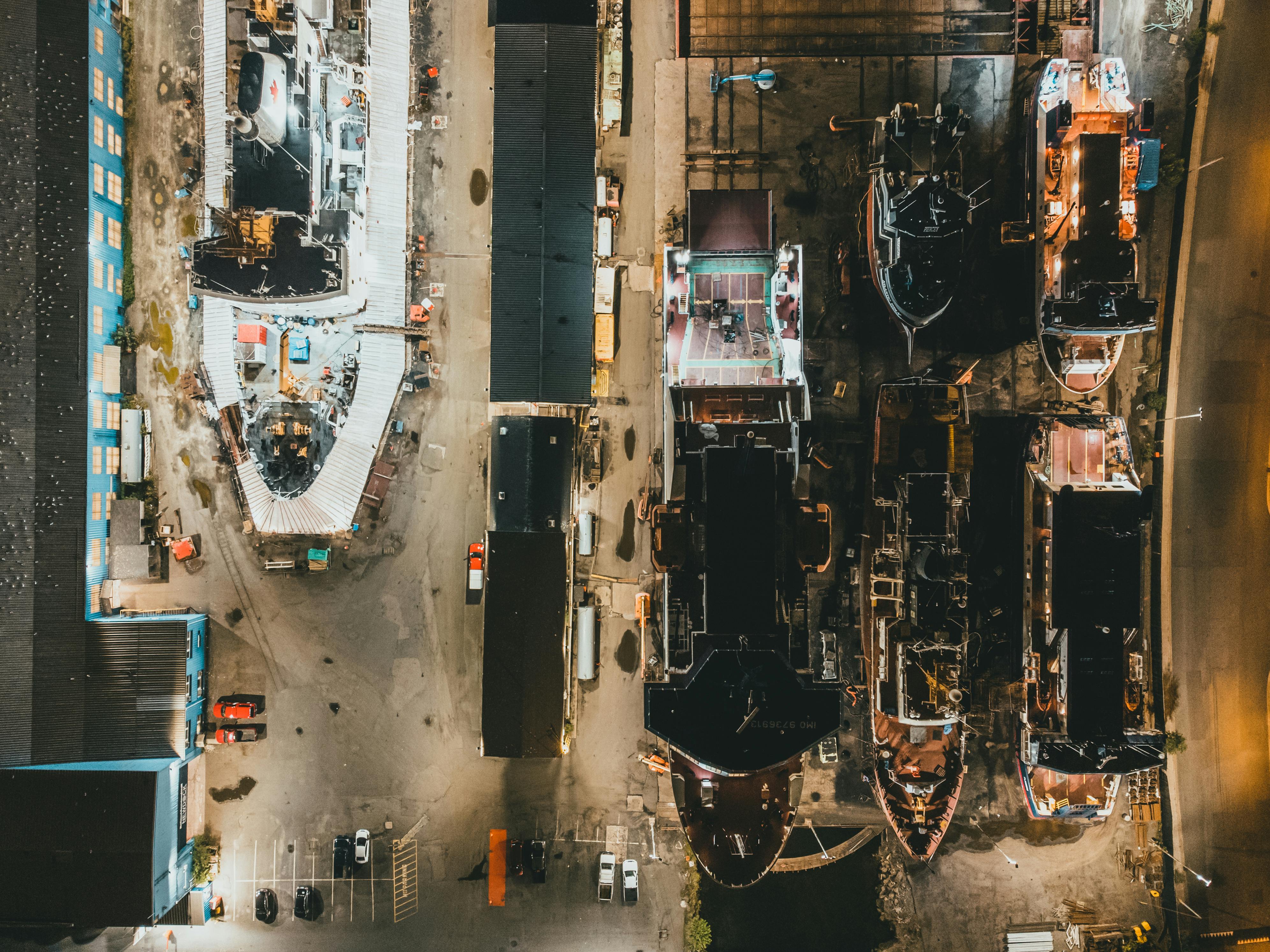 Top View of an Illuminated Port and a Container Ship · Free Stock Photo