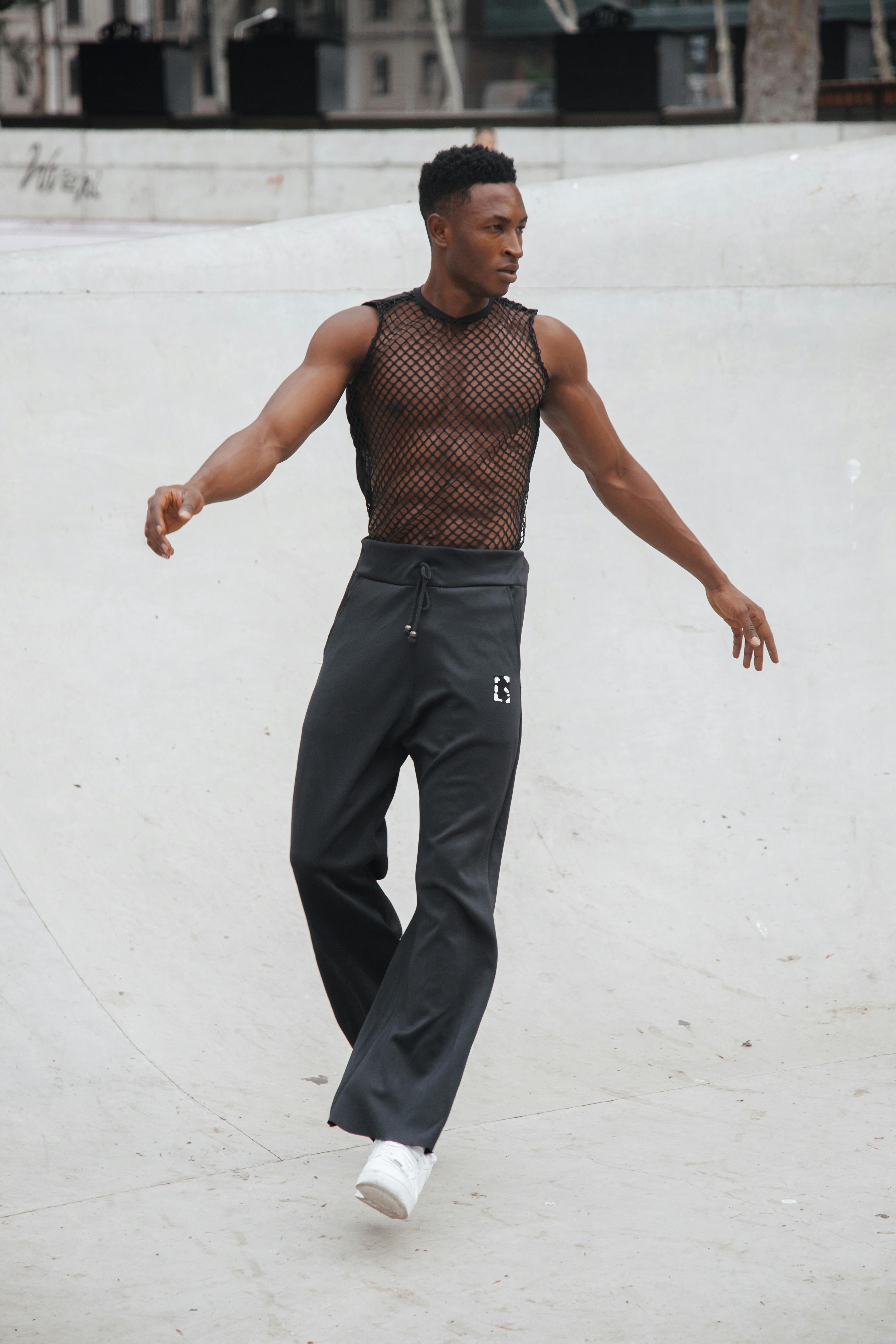 Man in Black Pants Standing on Gray Concrete Floor · Free Stock Photo