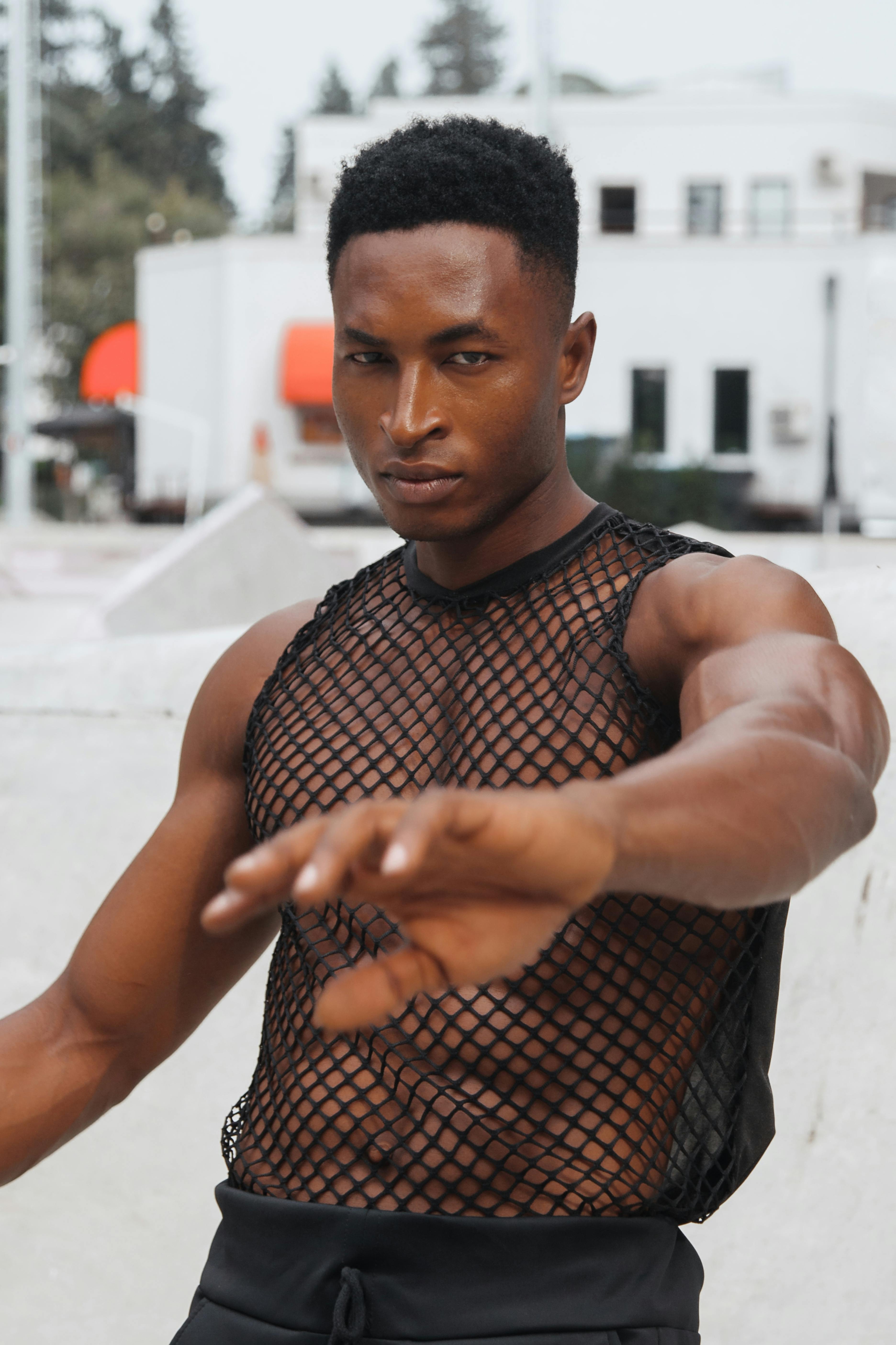 Man in Black Mesh Sleeveless Shirt · Free Stock Photo