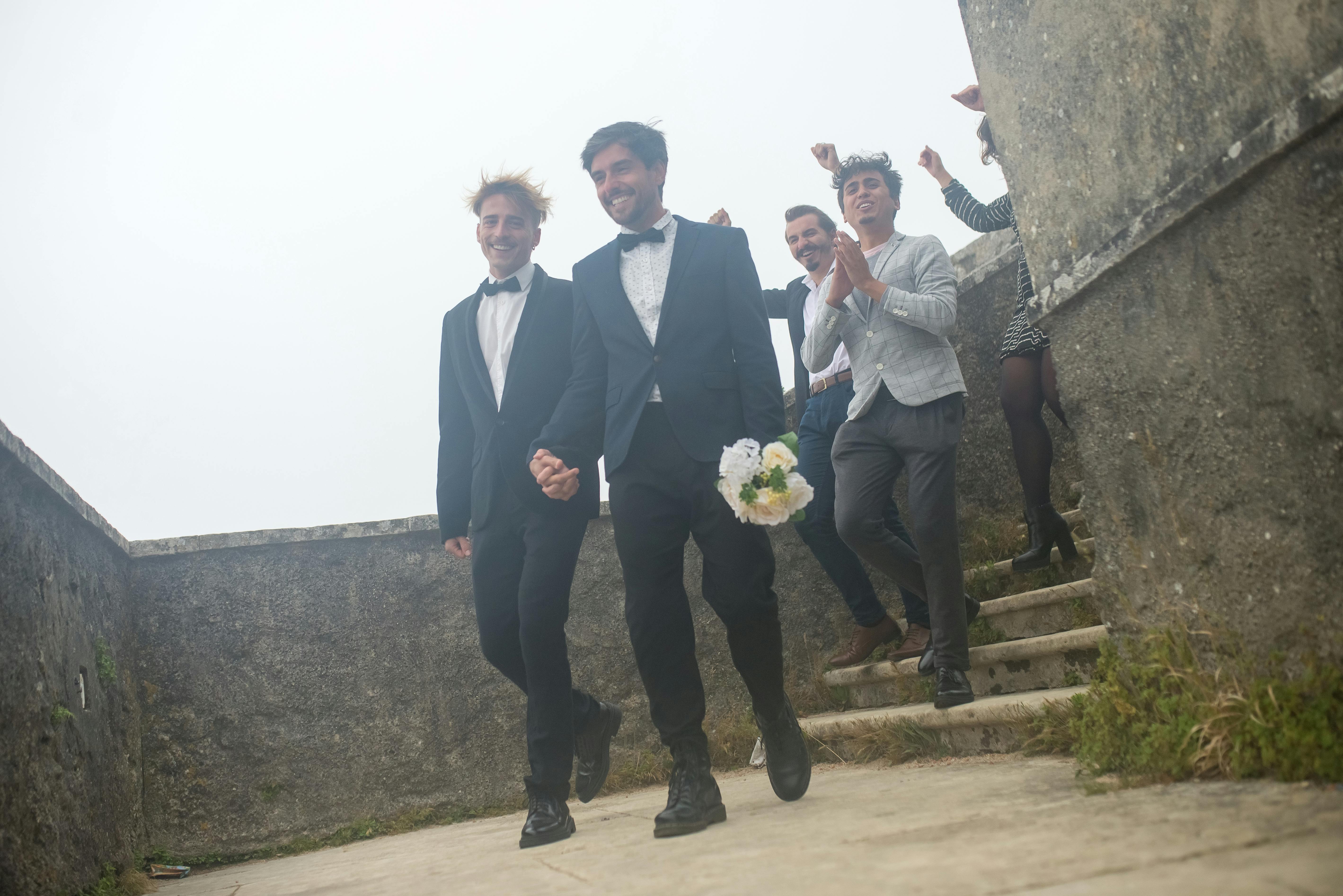 Happy Couple Walking while Holding Hands · Free Stock Photo