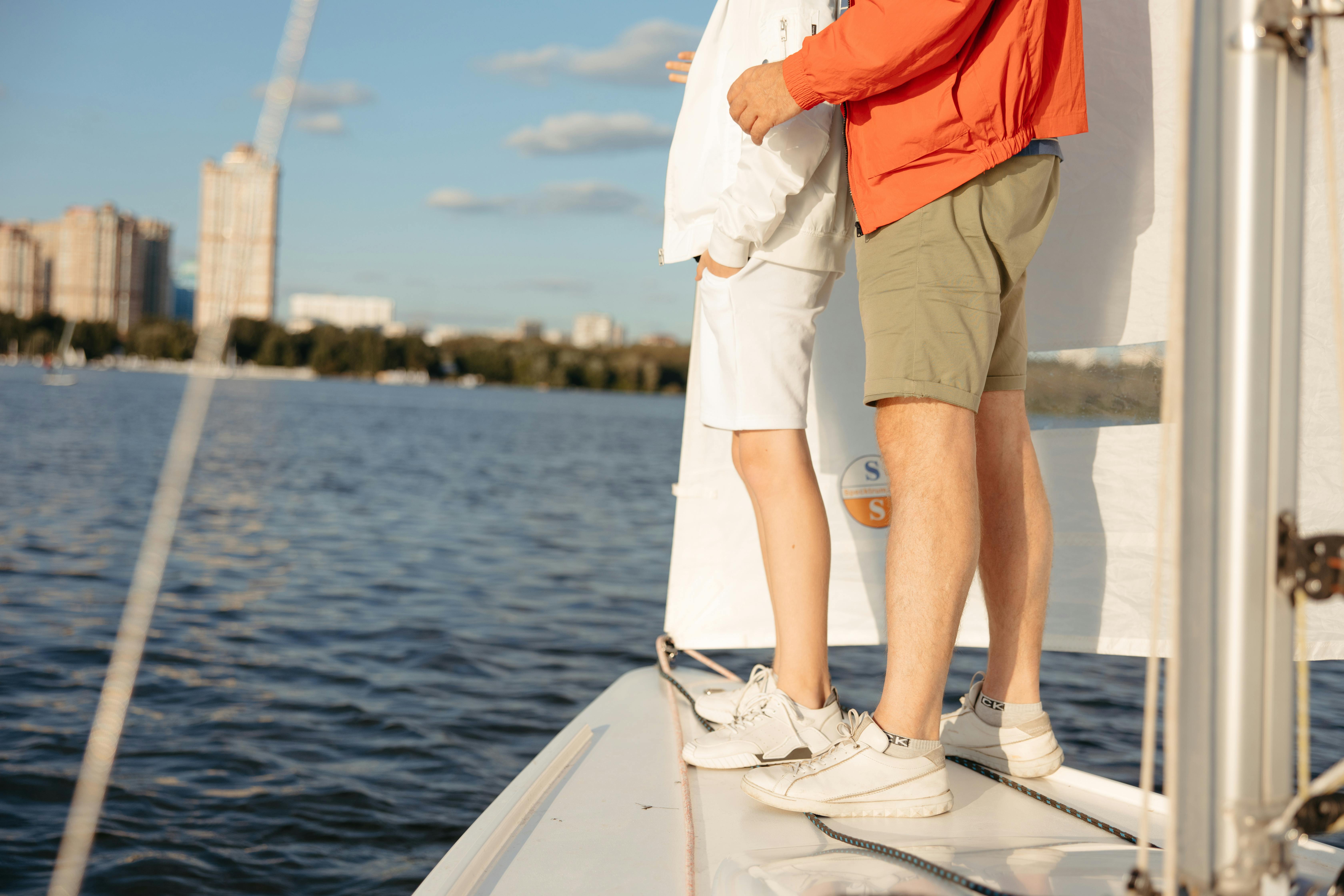 Men Standing on the Bow of a Boat · Free Stock Photo
