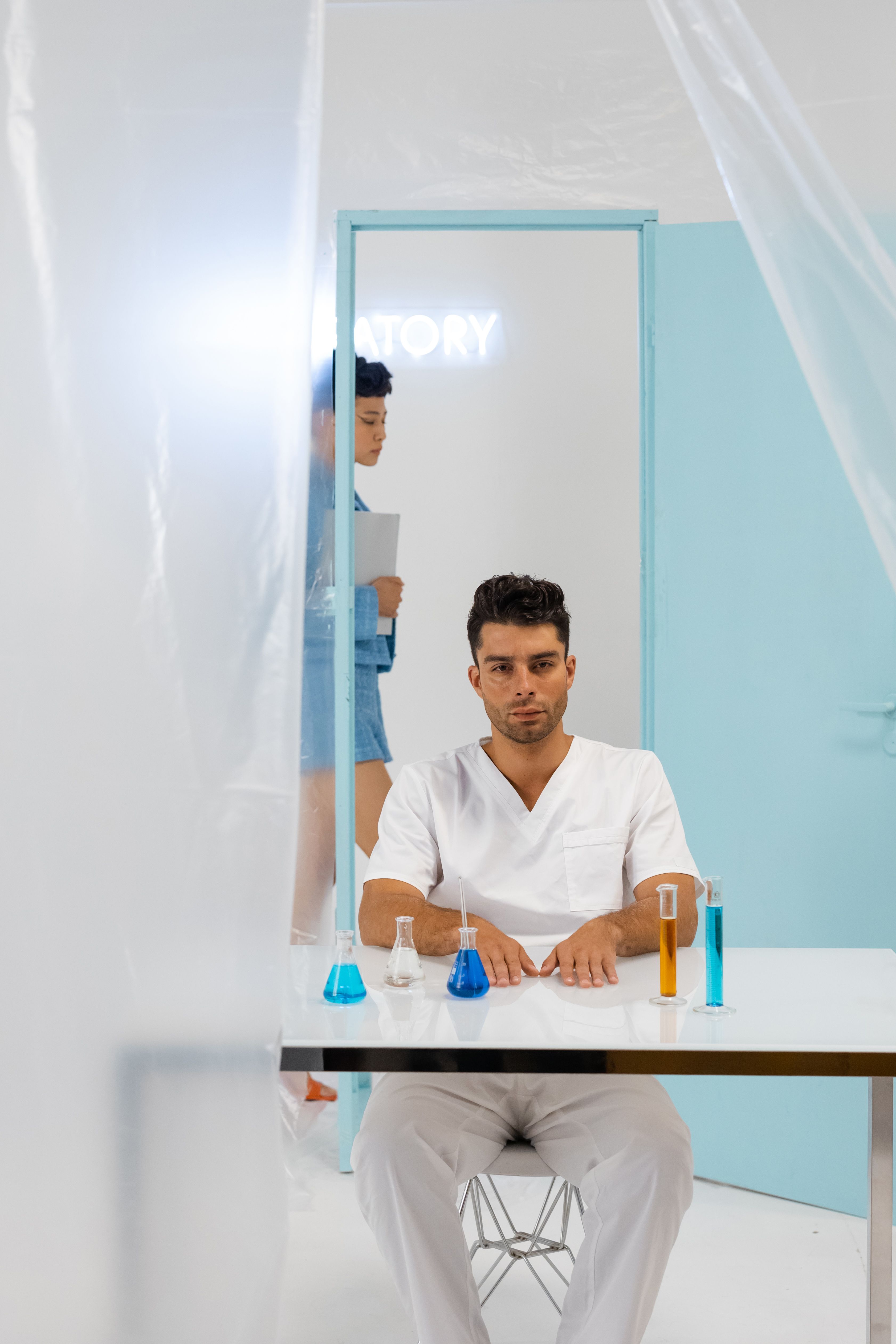 Man Sitting Behind a Table · Free Stock Photo