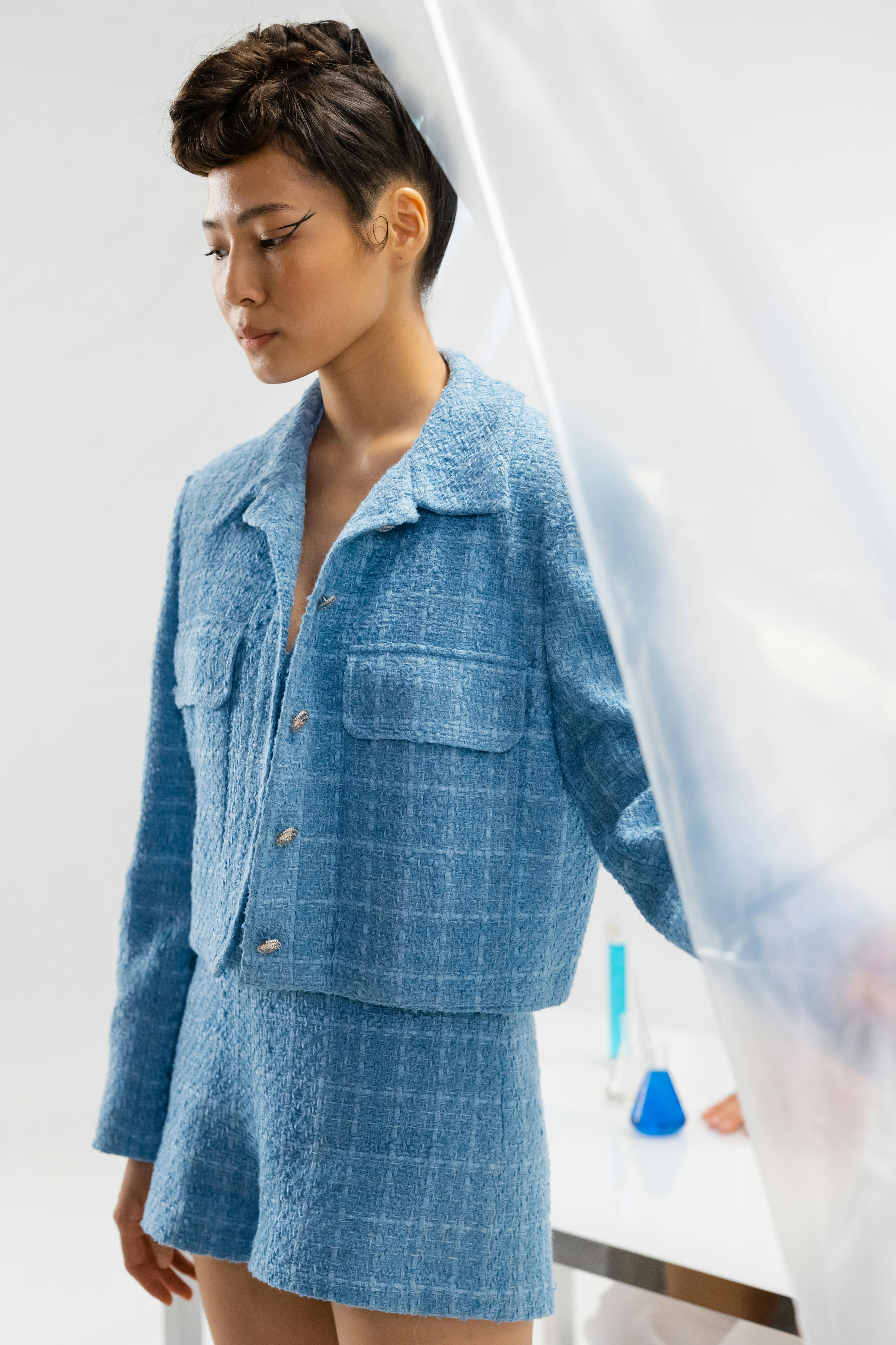 Woman in Blue Blazer Behind a Plastic Curtain · Free Stock Photo