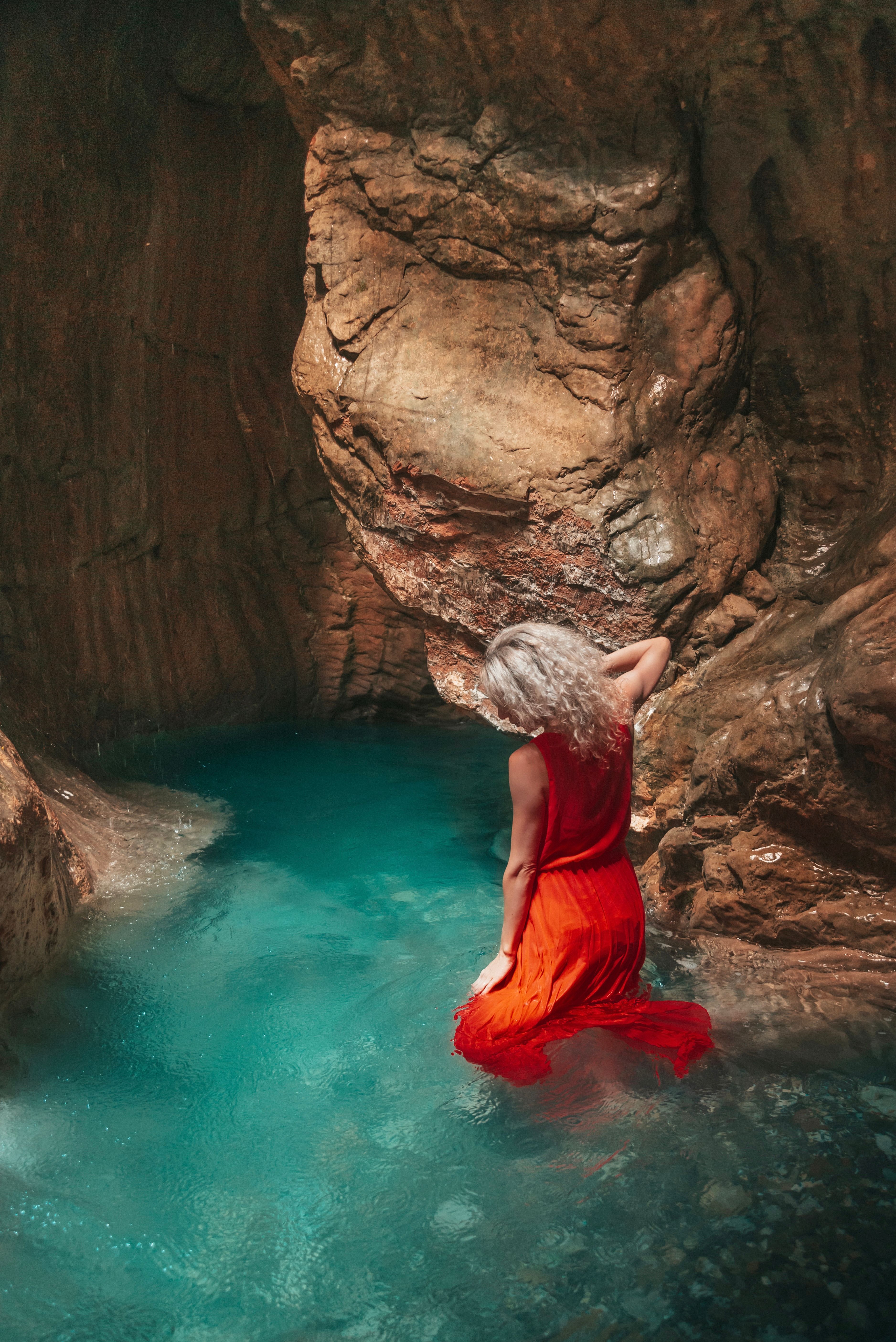 Woman in Red Dress Standing in the Sea with Fish Swimming Around · Free ...